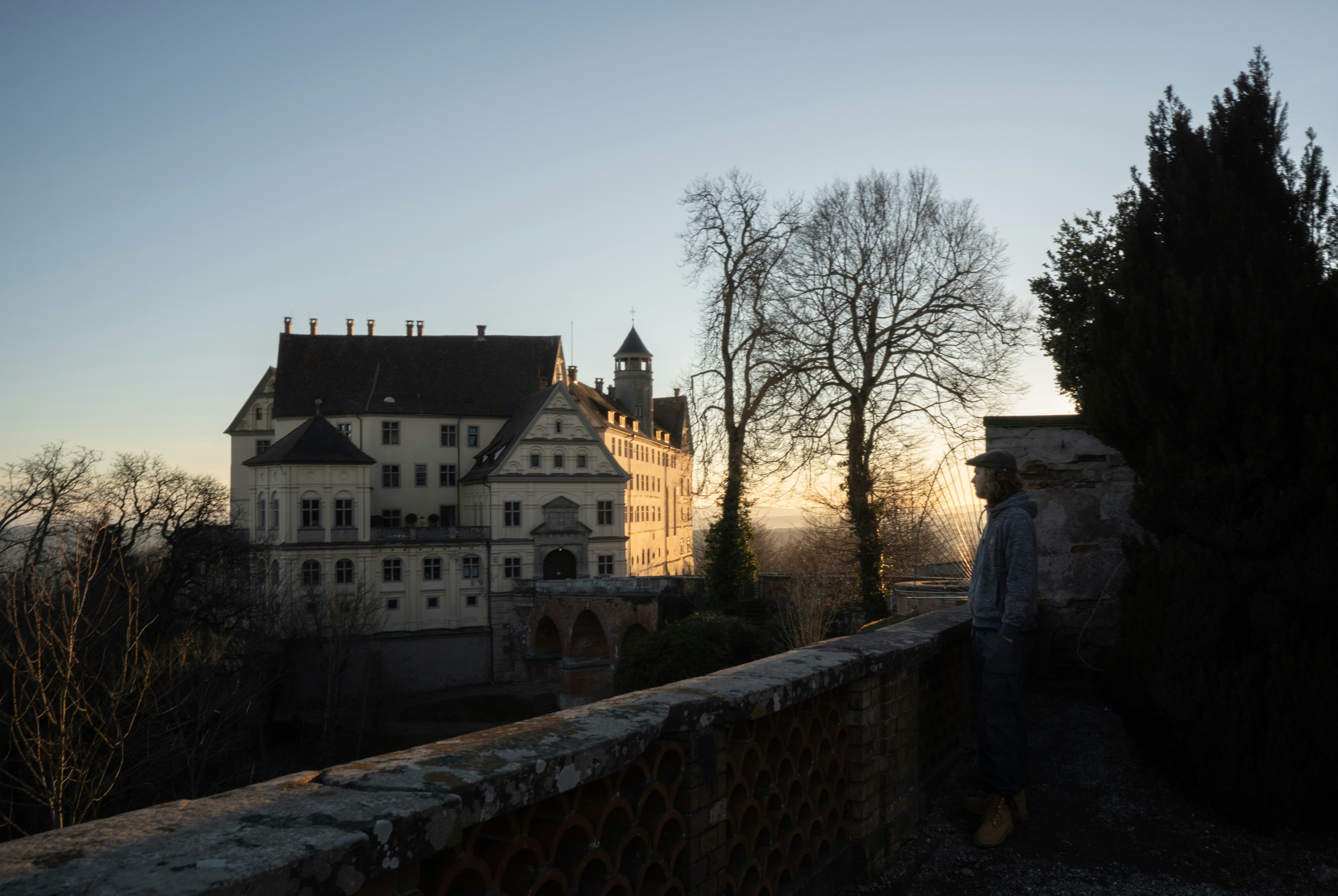 Sunset at Schloss Heiligenberg in Southern Germany | white concrete building beside green trees