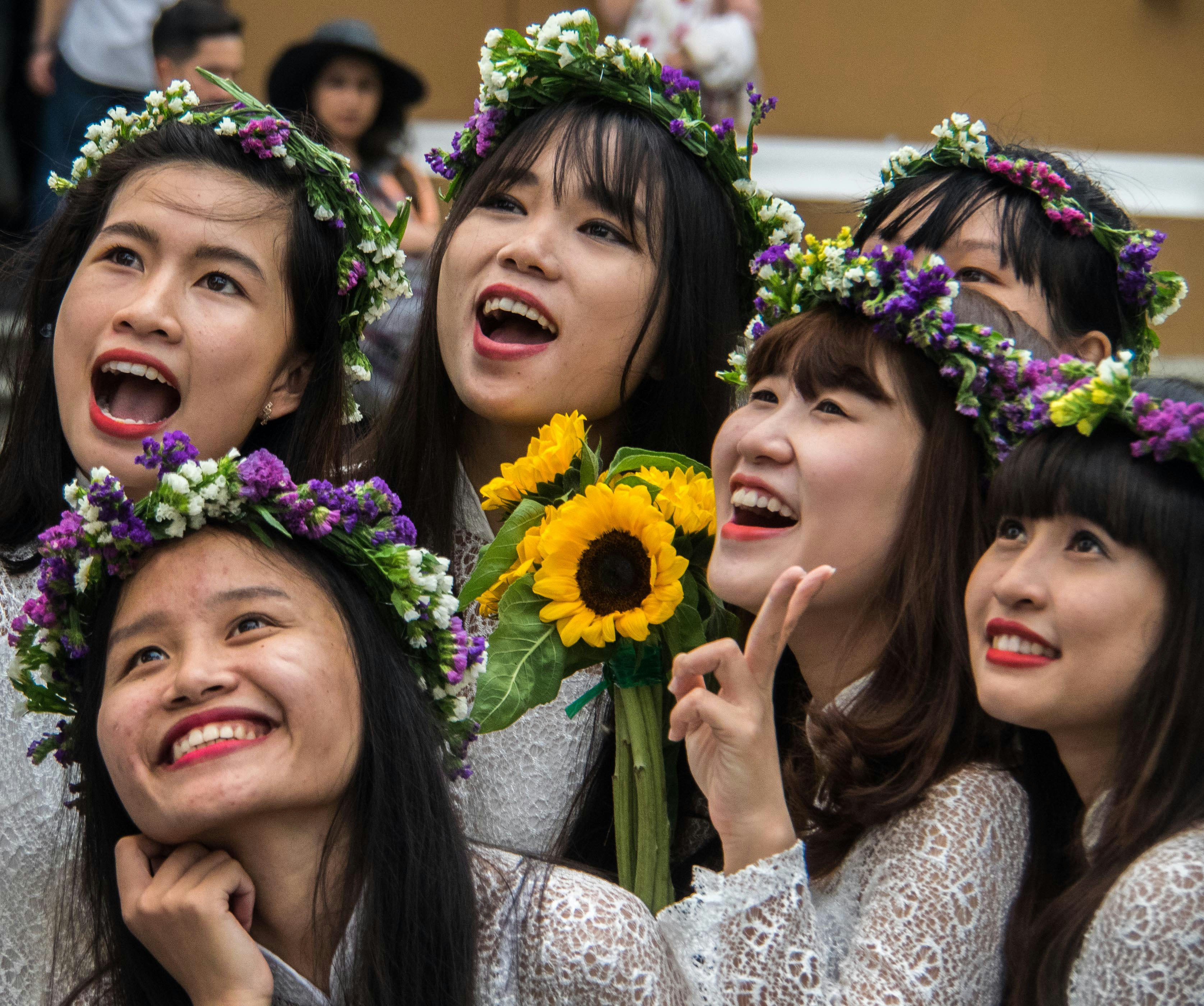Sunflower Chorus: A Moment of Jubilant Flower Crowns