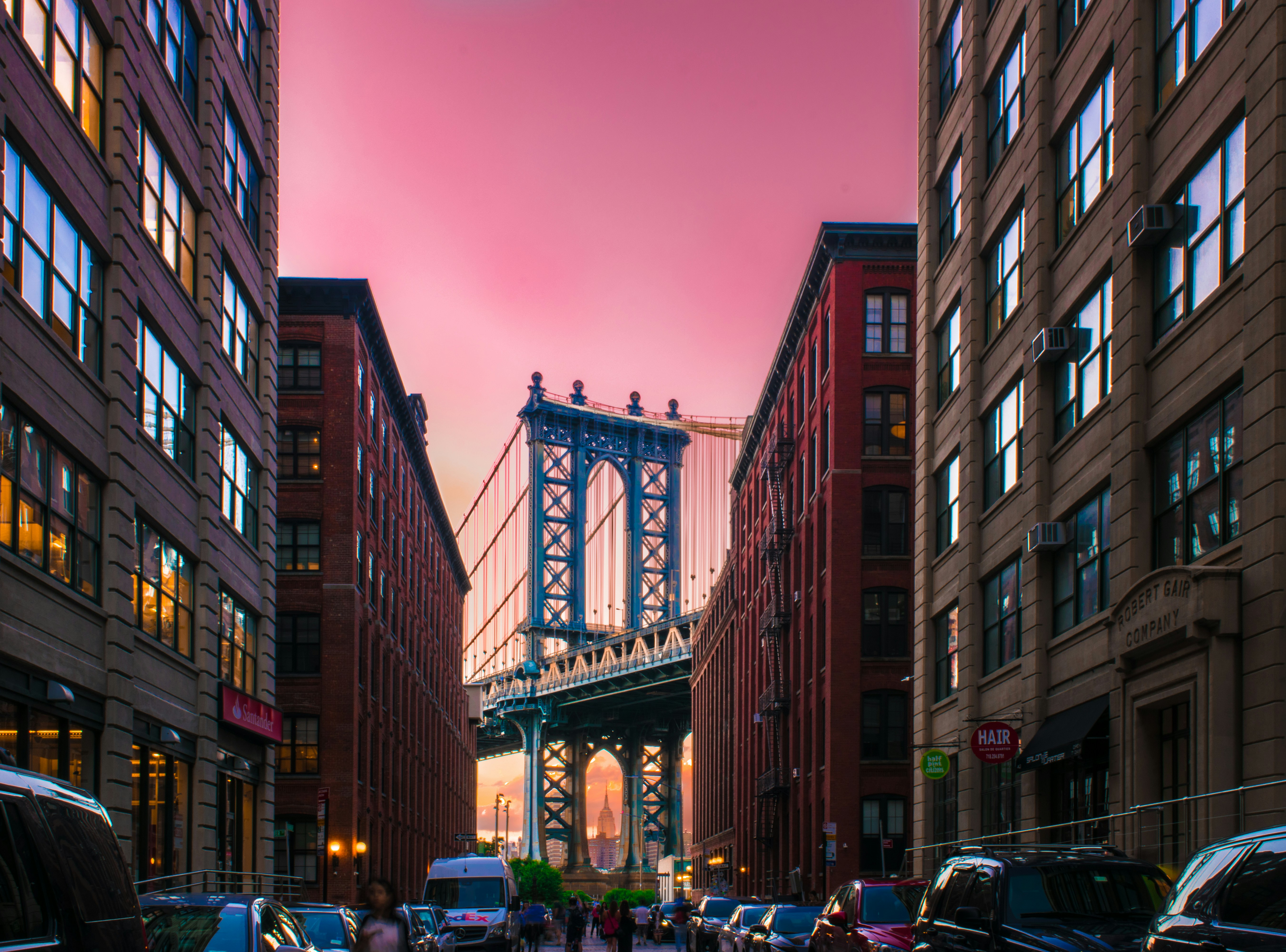 Urban Skyline Framed by Brick Canyons beneath a Violet Sunset