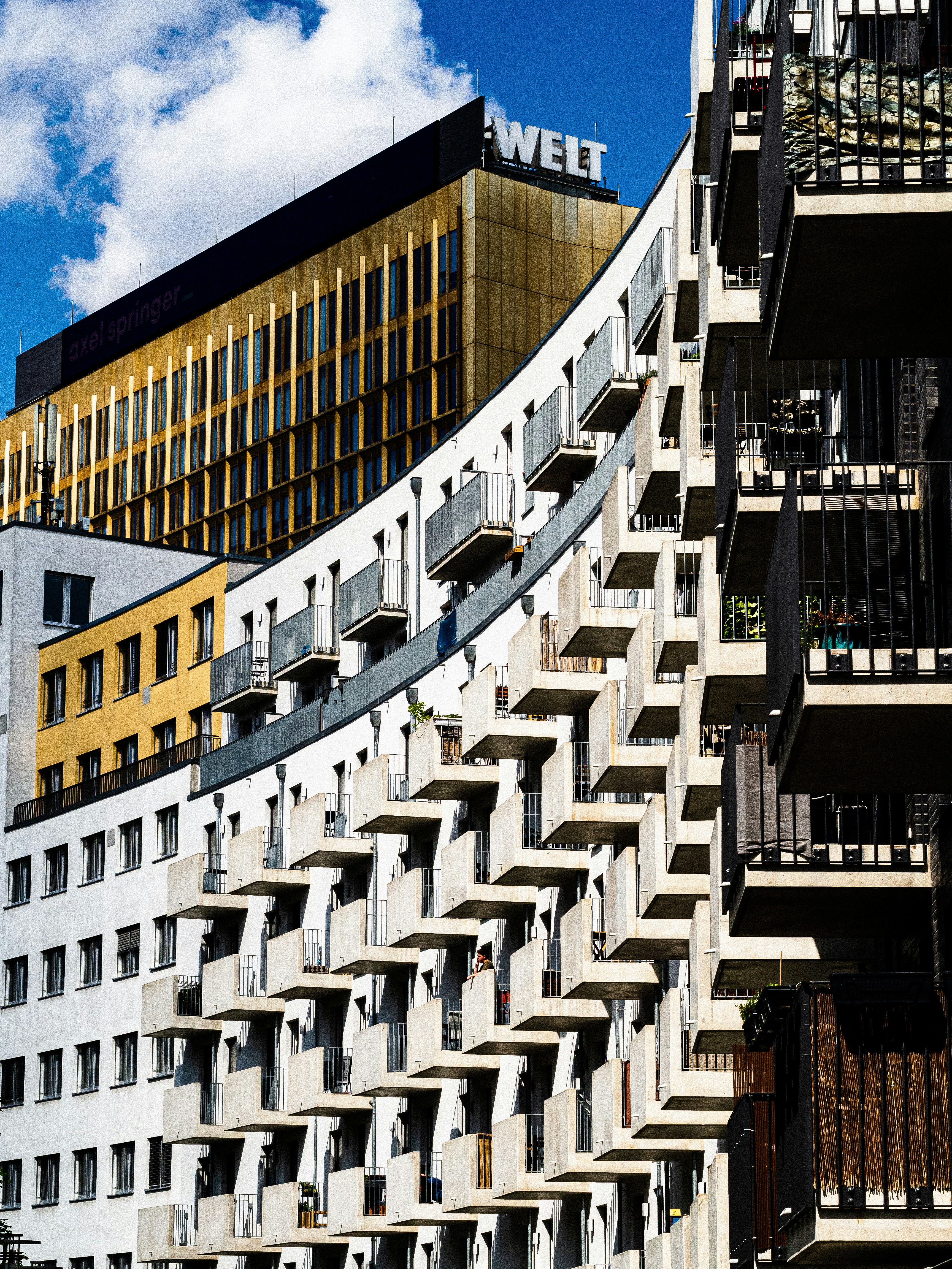 Serpentine Balconies: A Wave of White Geometries Climb a Modern Block