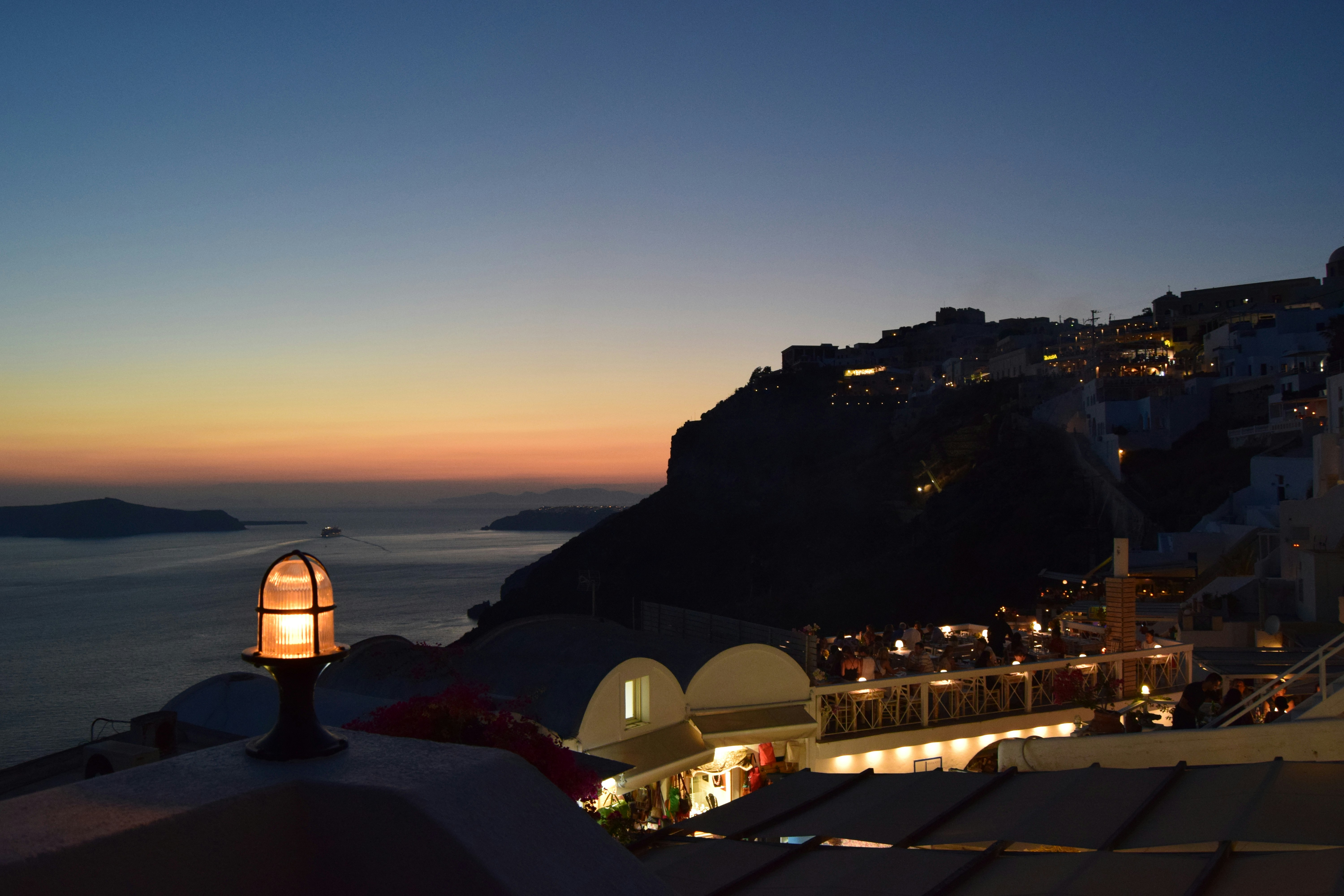 Twilight Lantern Over a Cliffside Village
