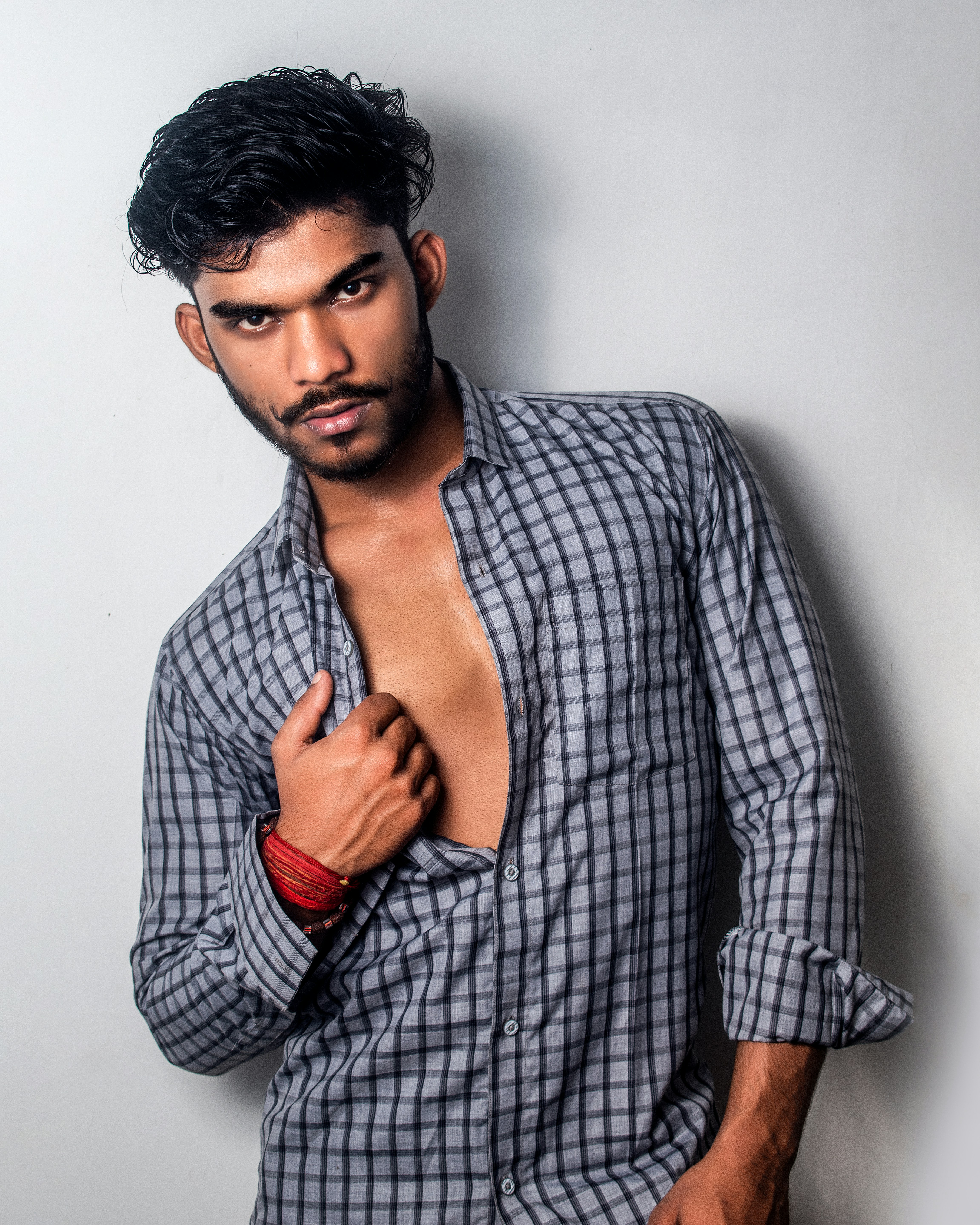 A man with a shirt on posing for a picture photo – Free Champa Image on ...