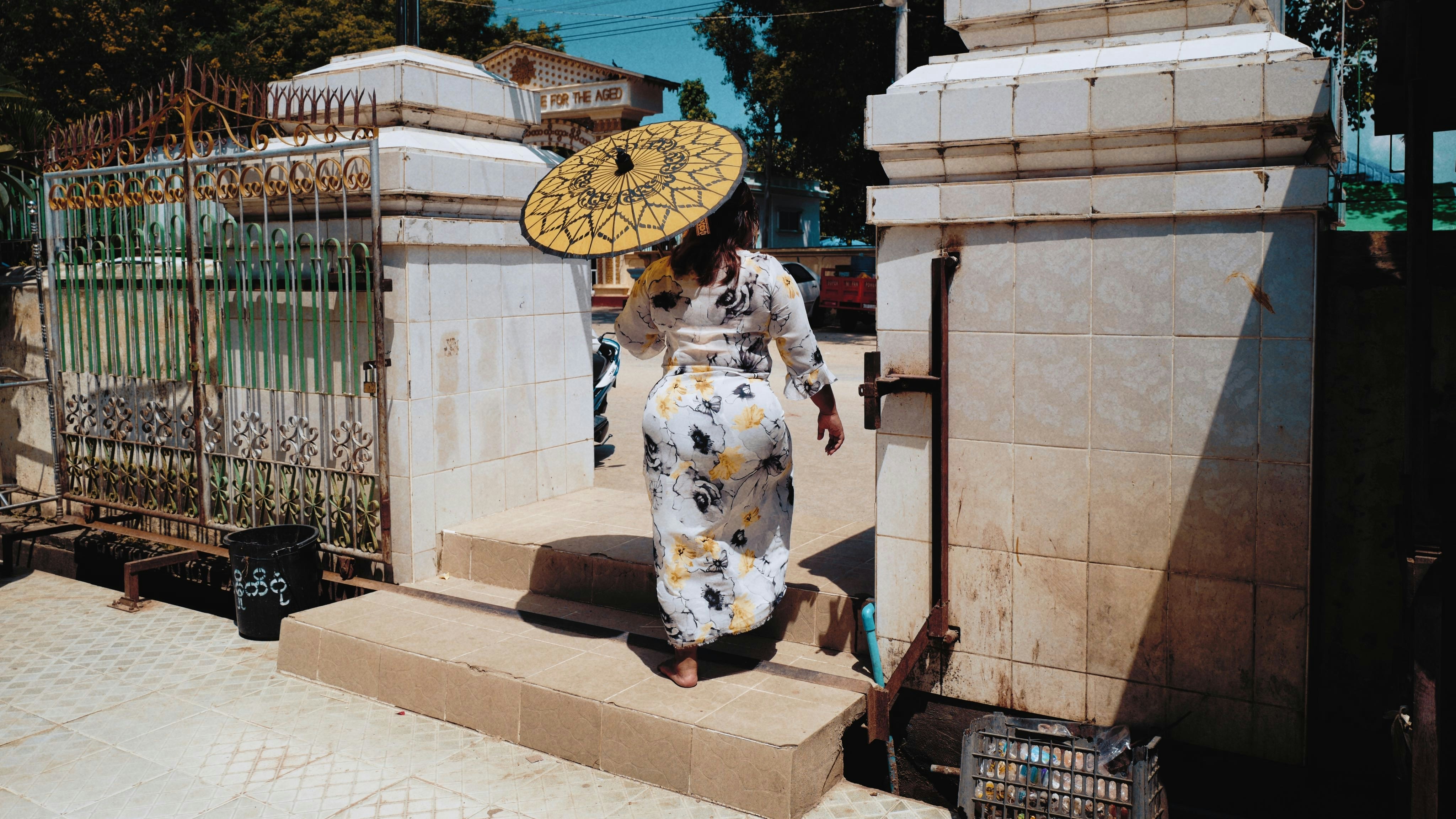 Umbrella and Steps: A Quiet Moment at the Gate