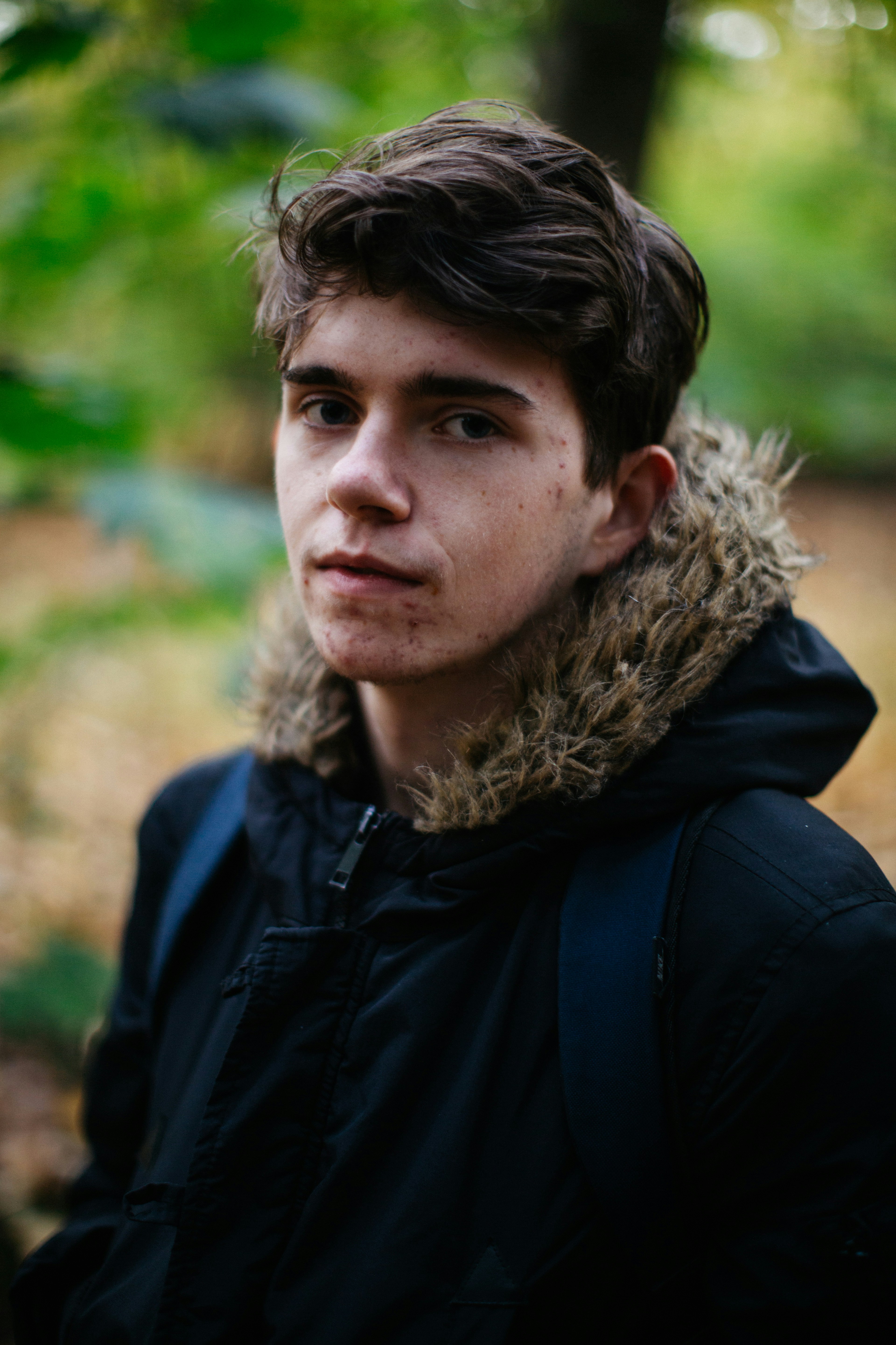 Man wearying black and gray fur jacket standing photo – Free Portrait ...