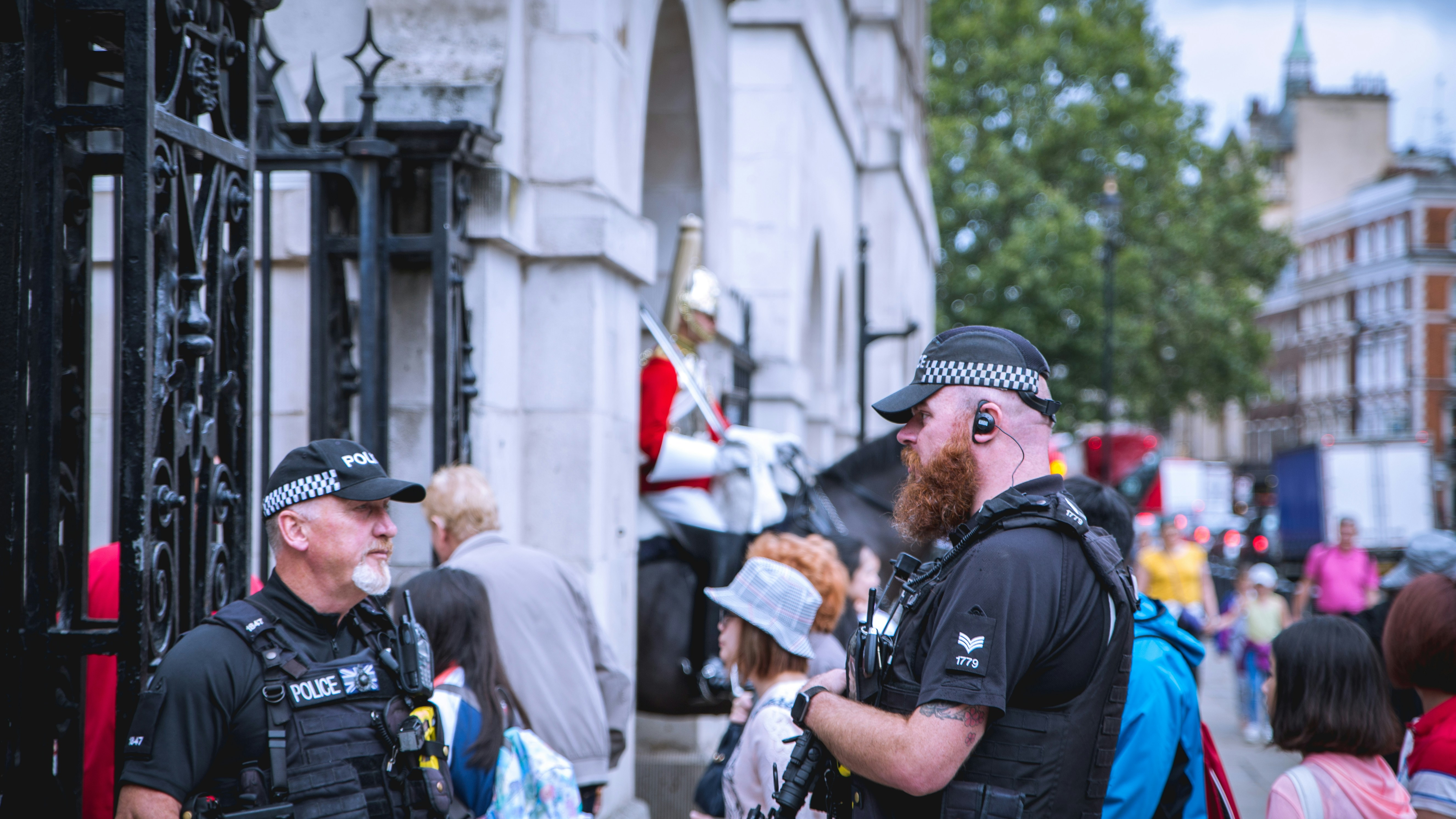 Two police officers guard the gate photo – Free Human Image on Unsplash