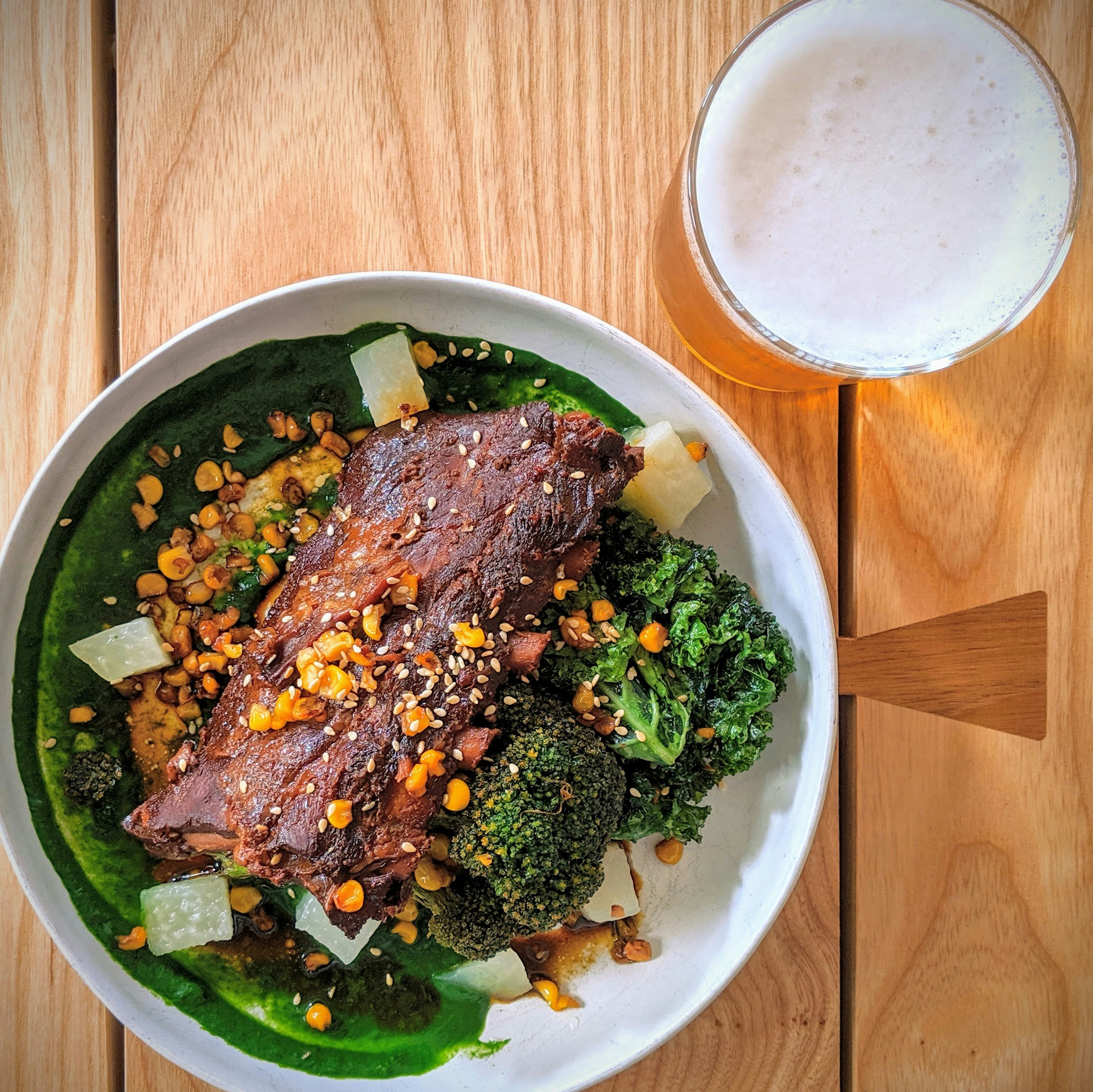 Seared Protein Over Green Mosaic with Crunch and Beer Foam