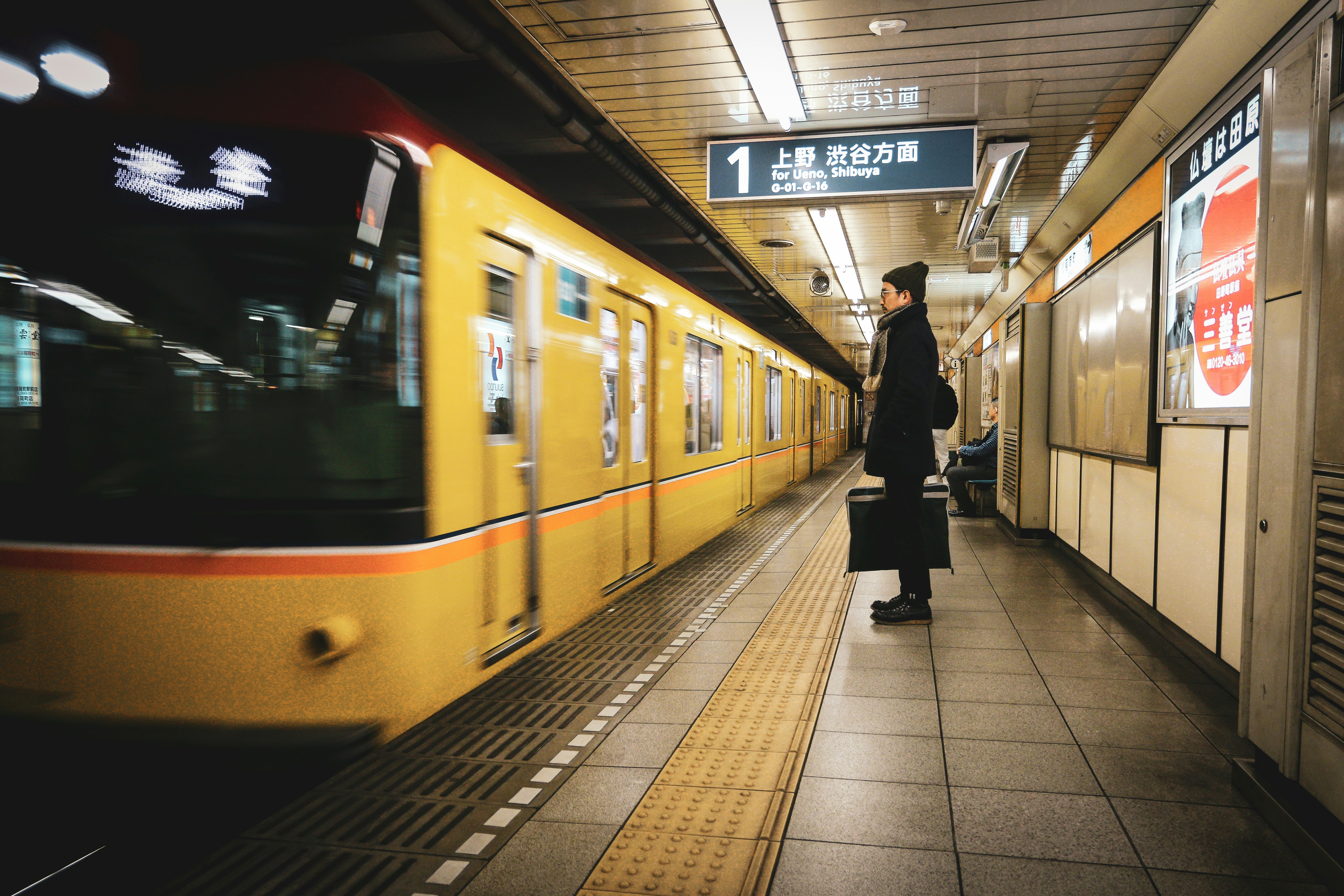 Man standing inside train station photo – Free Train station Image on ...