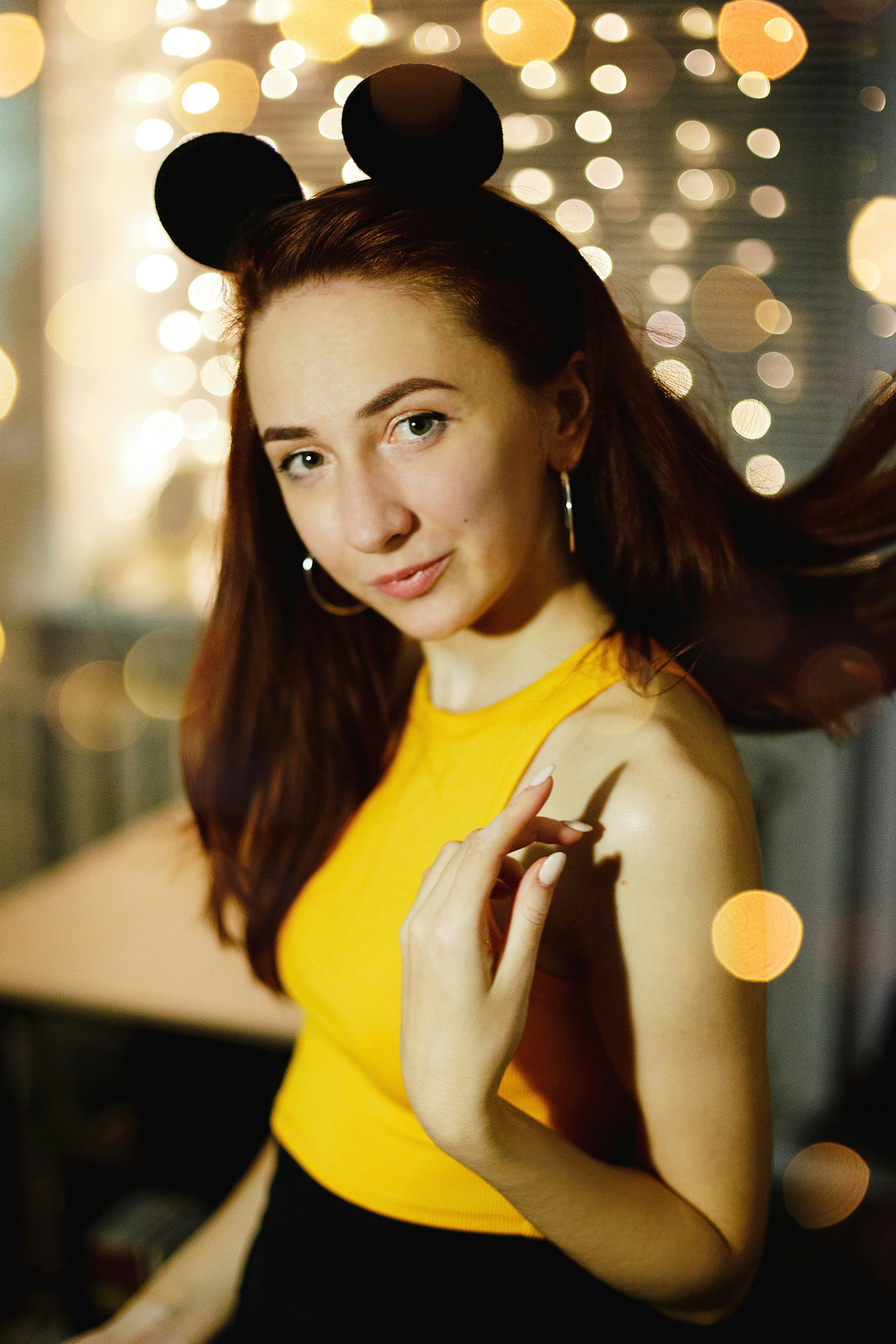 Bokeh-lit Portrait: Mickey Ears in a Warm City Glow