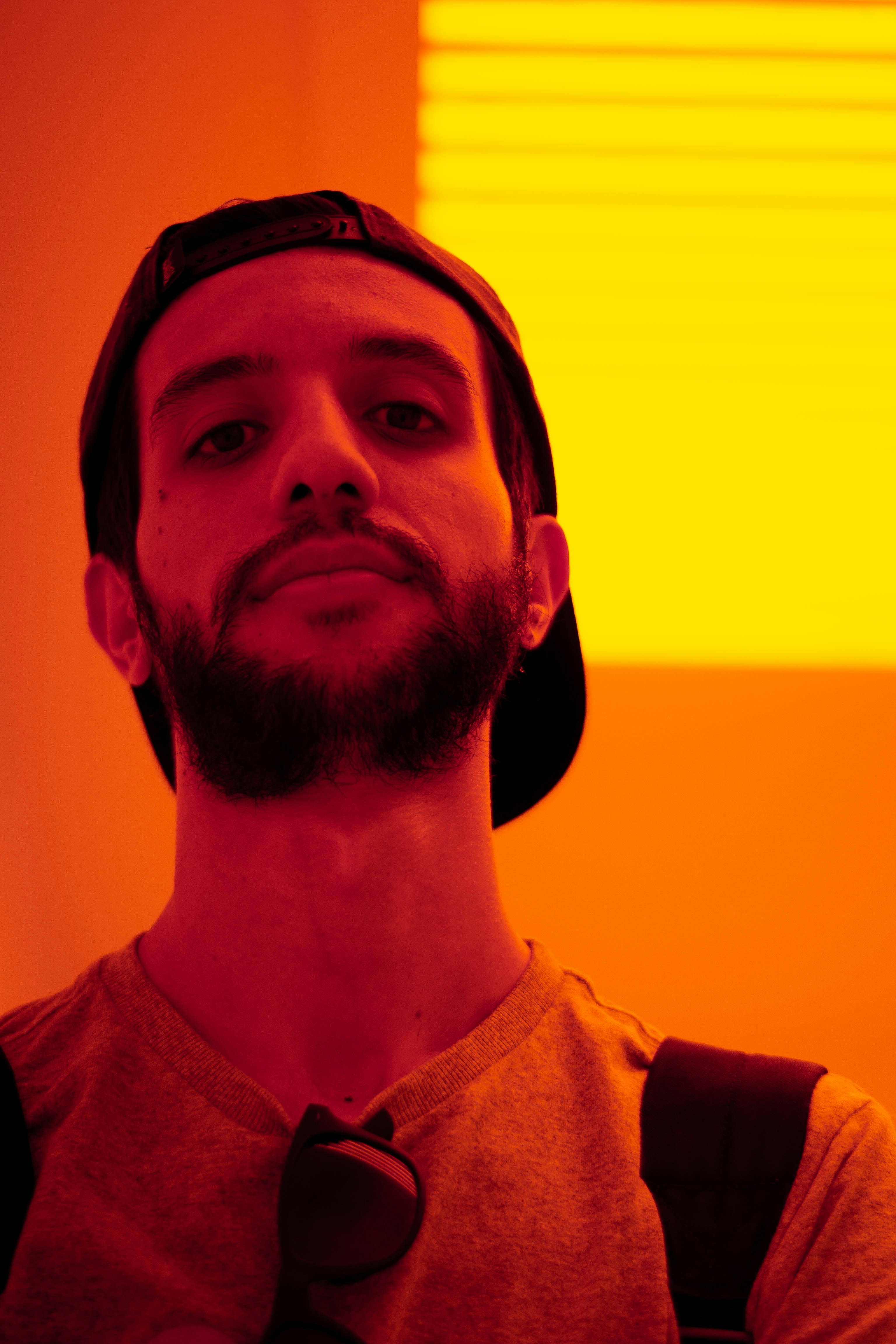 Bearded in Amber: Portrait under an Electric Orange Glow