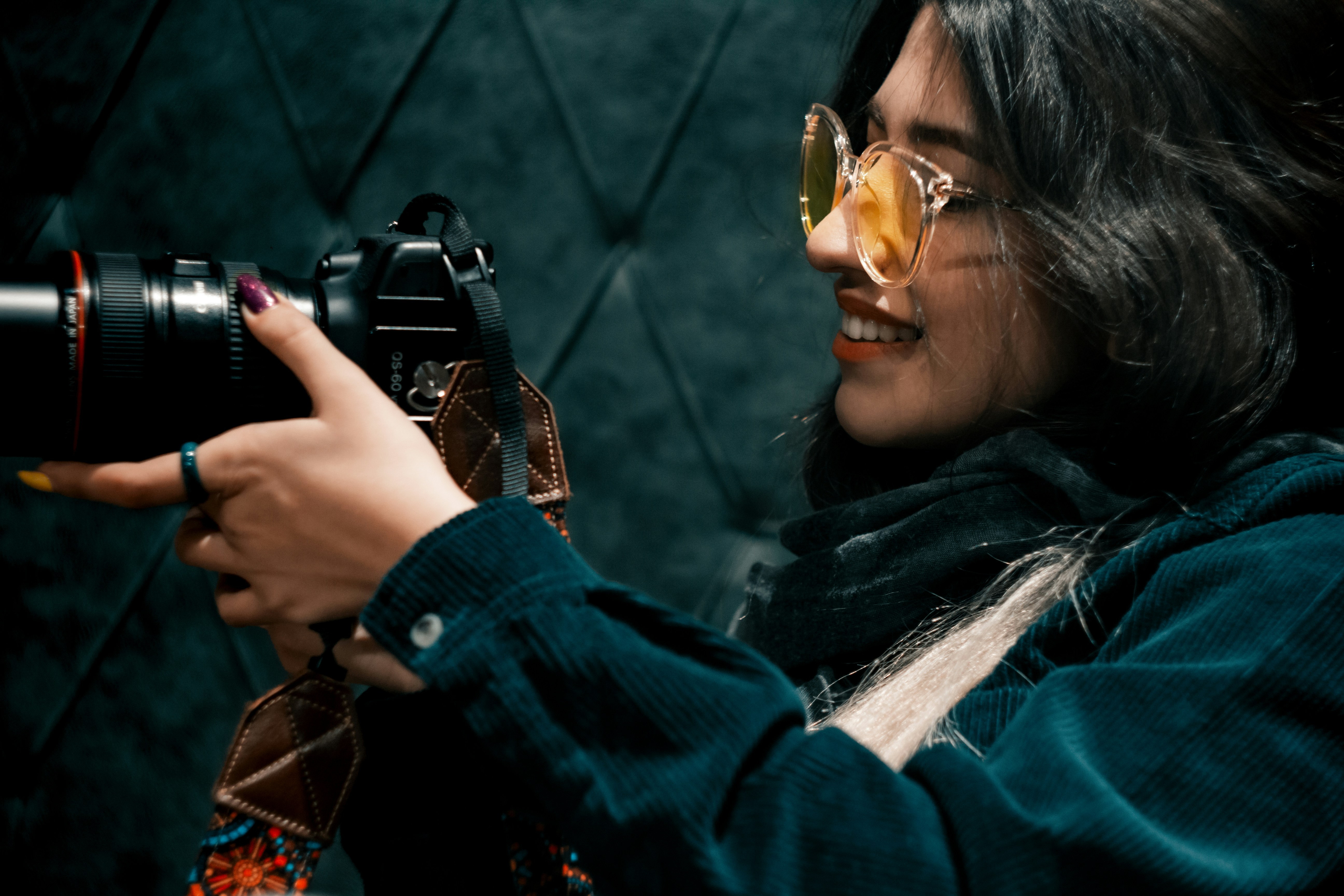 Velvet Teal Focus: A Portrait of a Photographer with a Vintage Lens