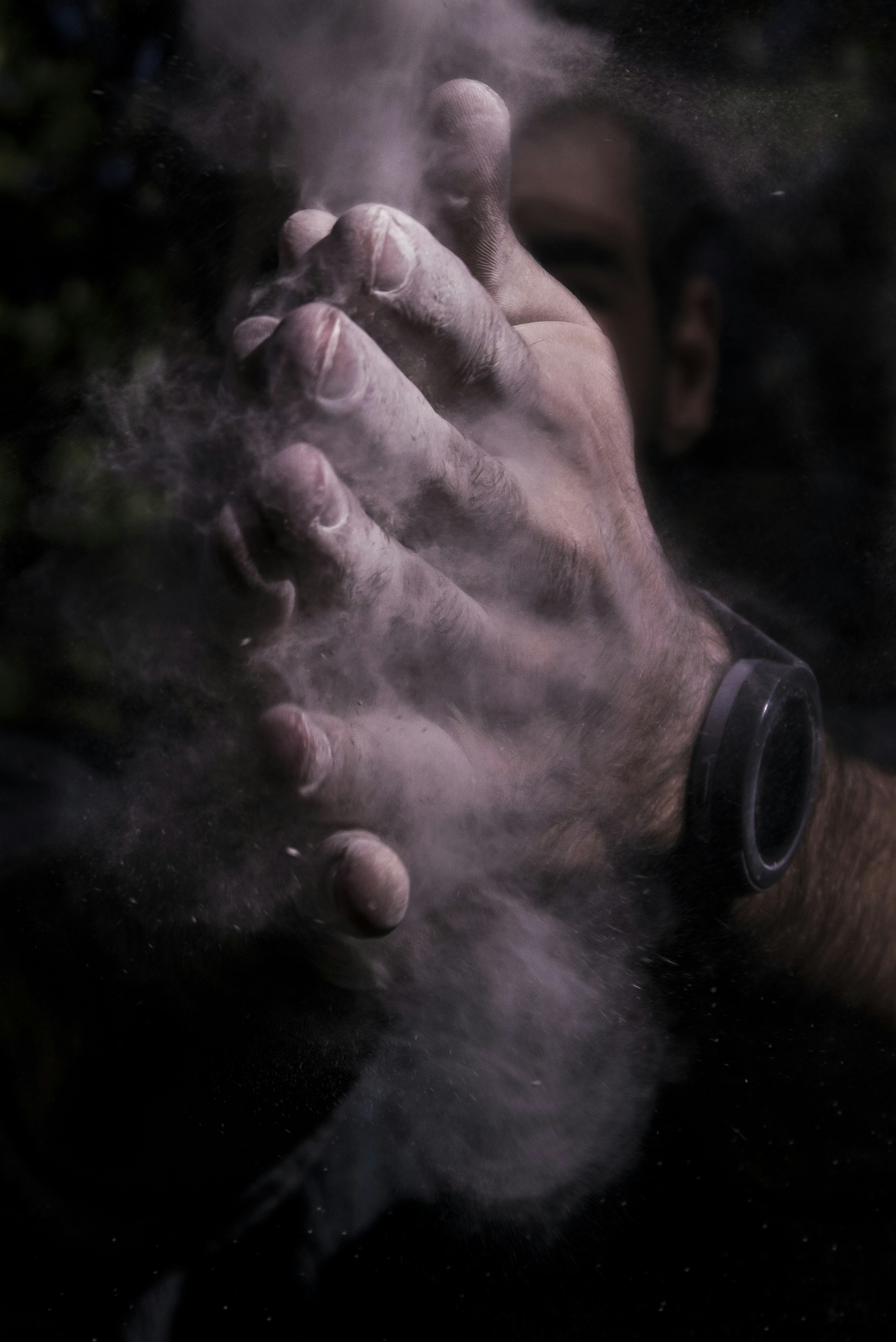 Concentrated Silence: Hands Clasped in Cloud of Smoke