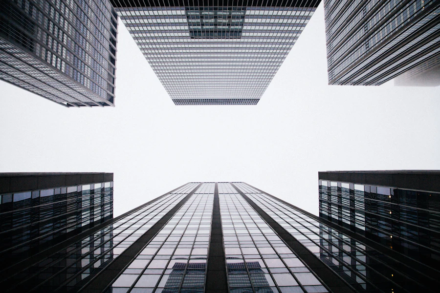 Office buildings under clouds | worm's eye view of buildings