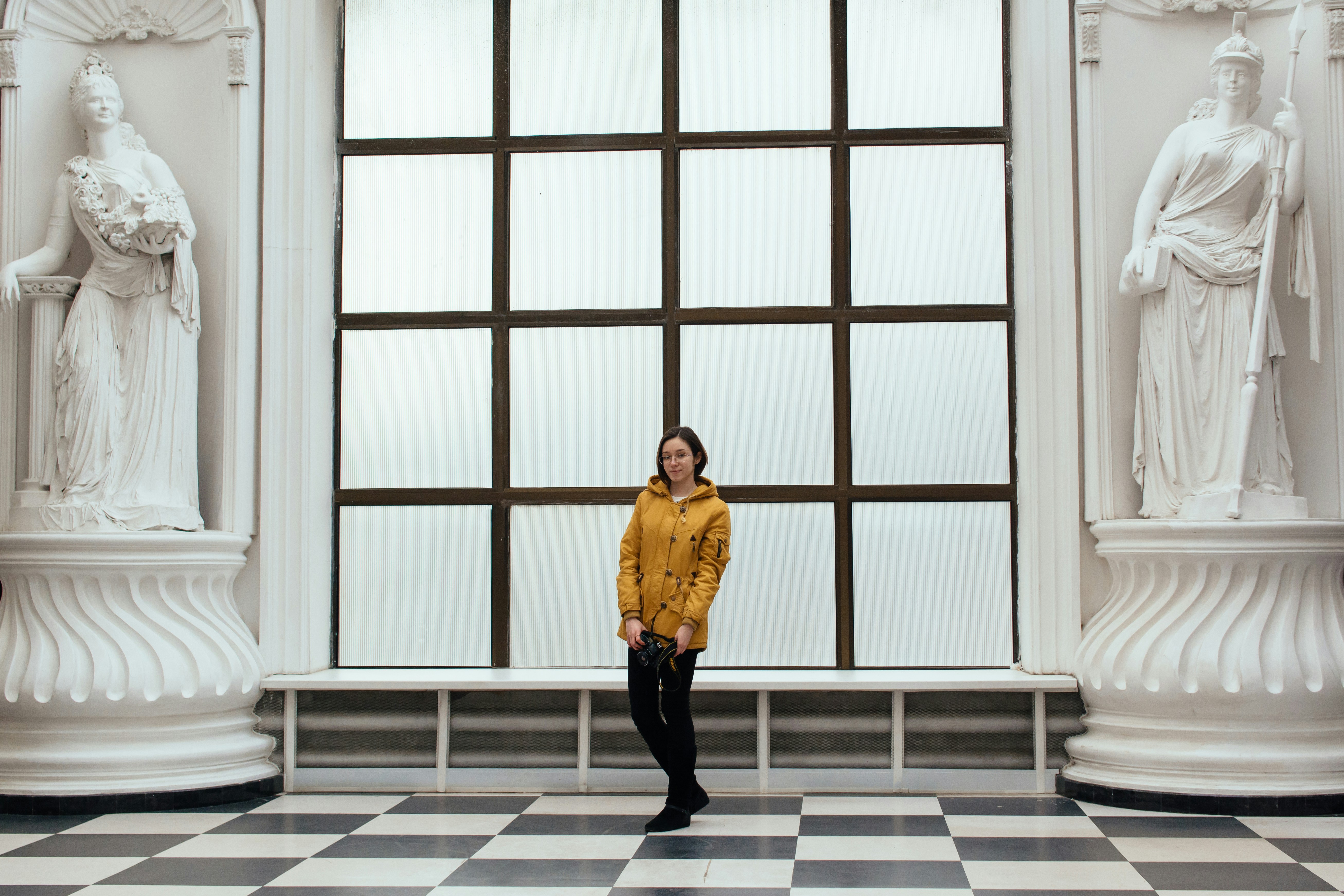 Yellow in the Marble Hall: Portrait Under Monumental Windows