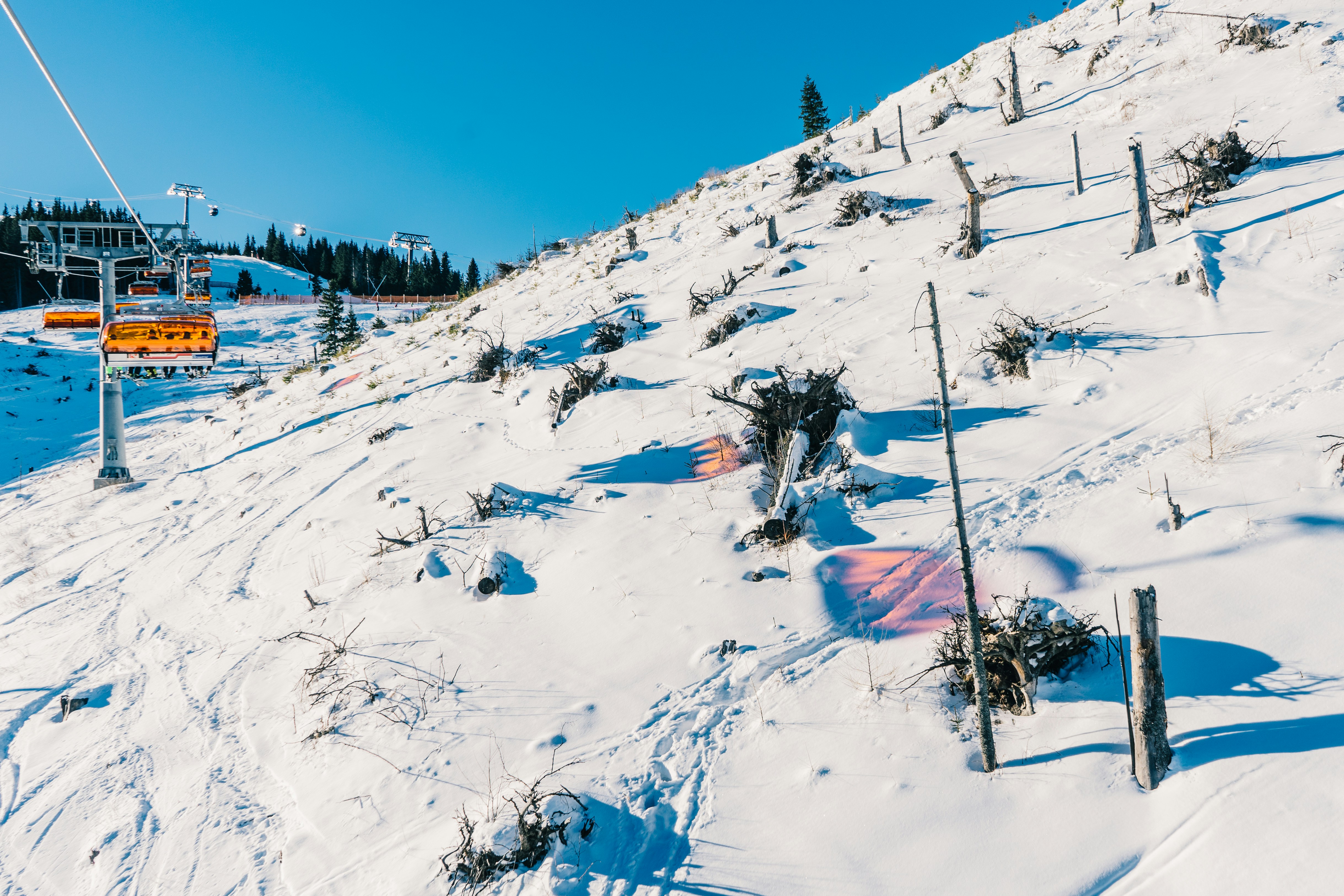 This chairlift offers one of the greatest views at Jasna Low Tatras resort in Slovakia. Love the shadows left by the chairs on the snow.
