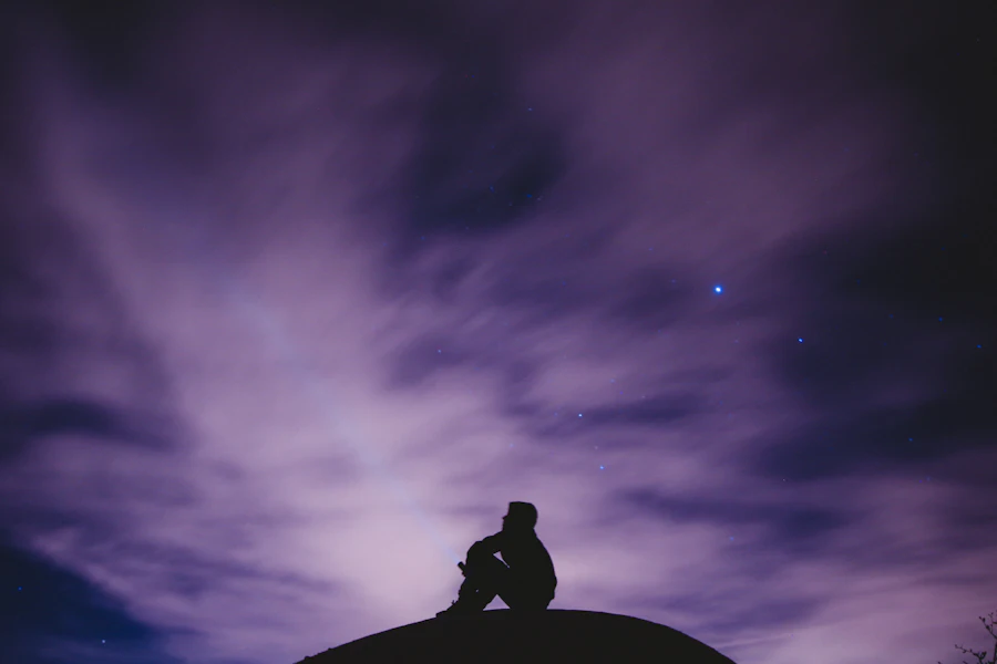 It is amazing what we have come to find beyond the earth in this vast Universe. So many beautiful planets and other galaxies with such complex ideas we cannot fathom. How was this all created? And why? I would start by looking in the Bible | person sitting on black surface looking to sky