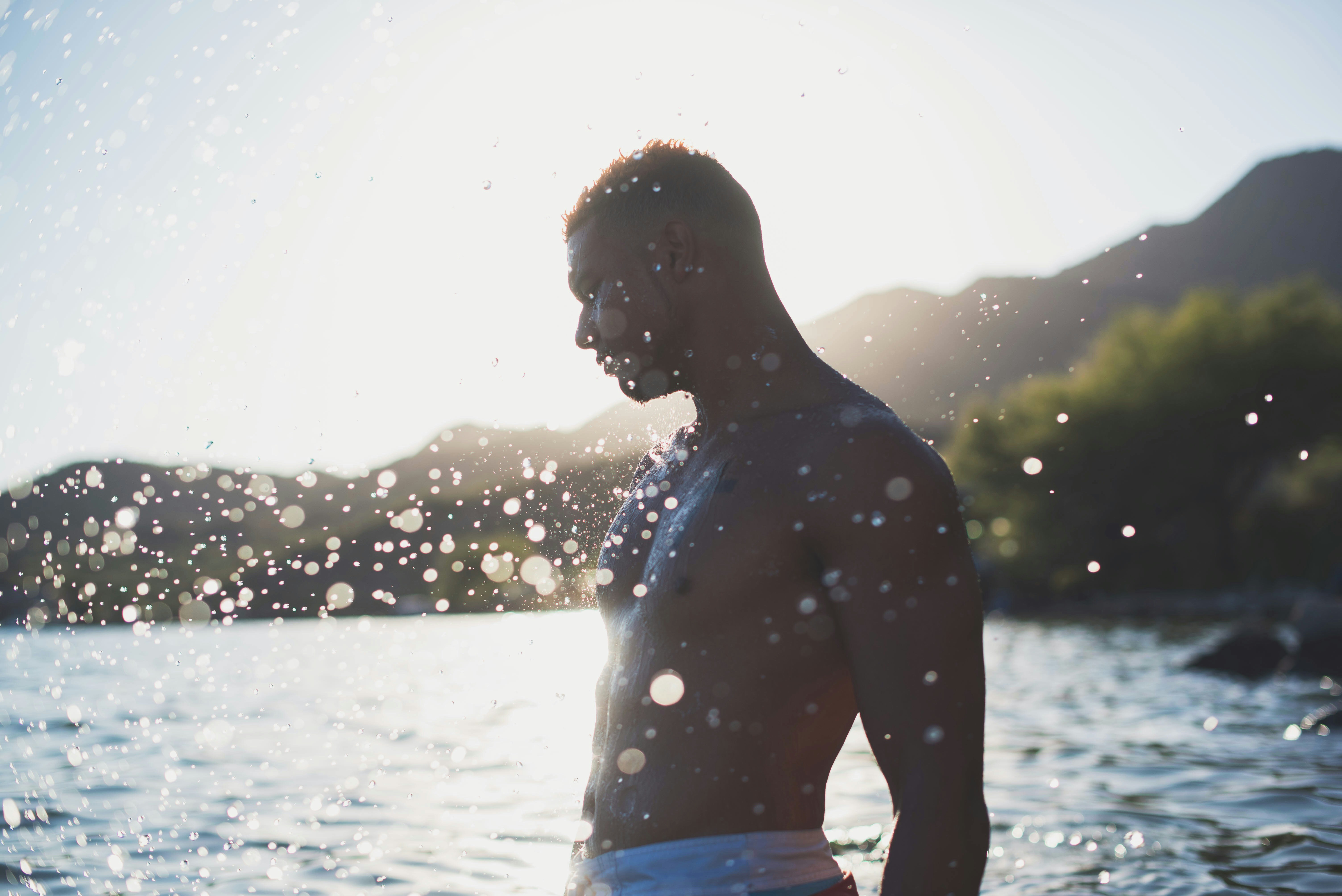 Splash of Summer | a man standing in a body of water