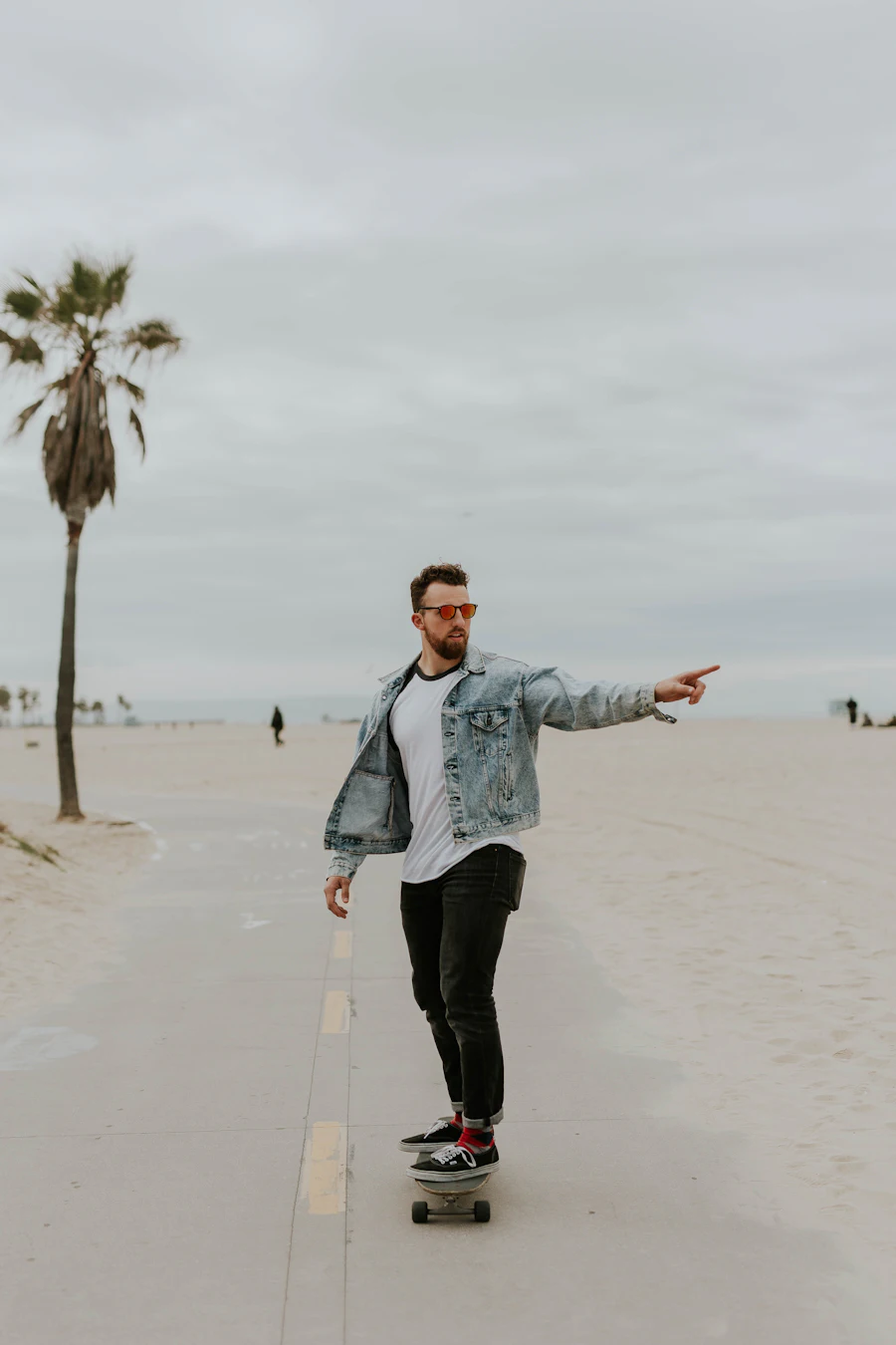Skater skateboarding | men's washed denim jacket riding a skateboard