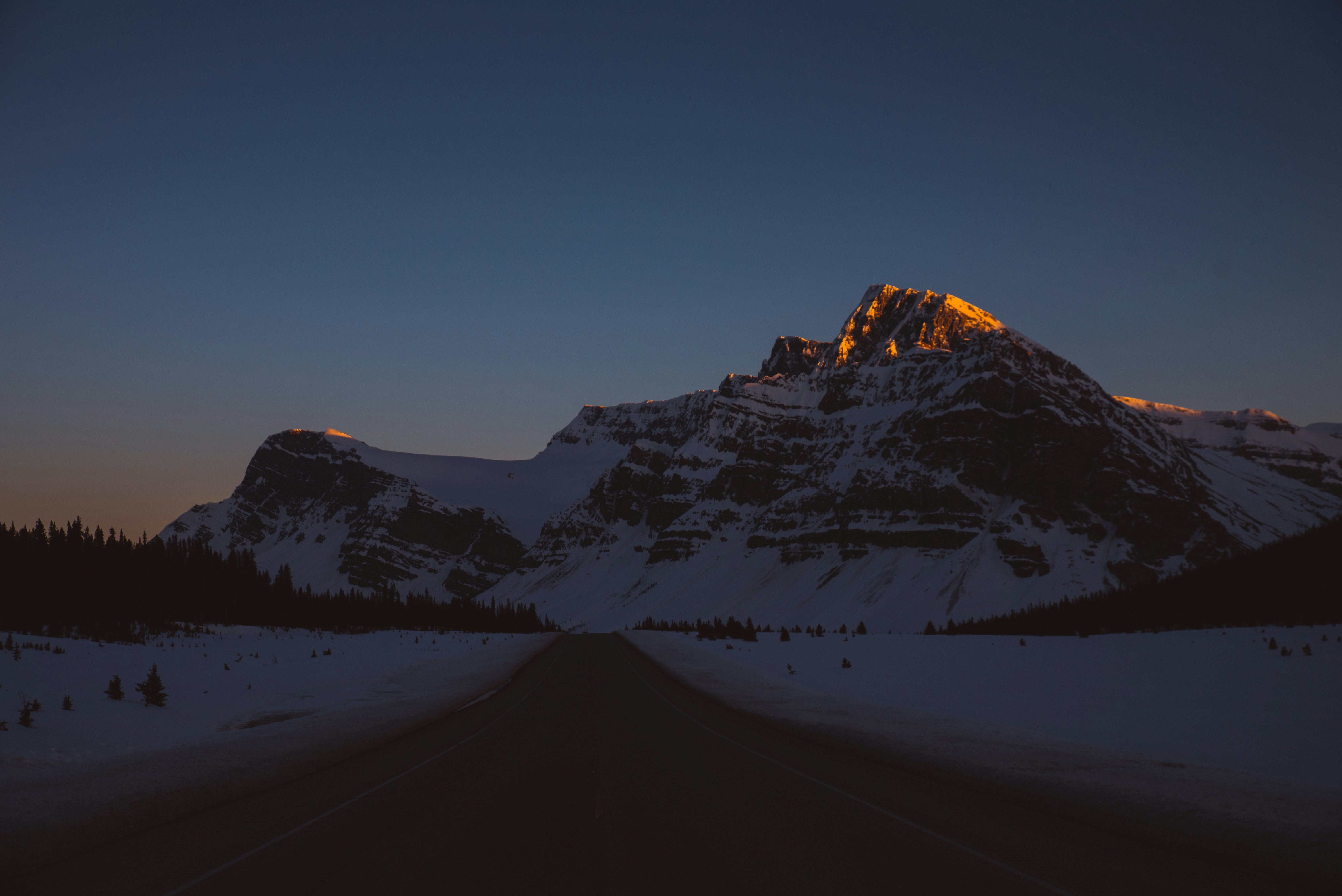 Mountain road in the evening | snow capped mountain