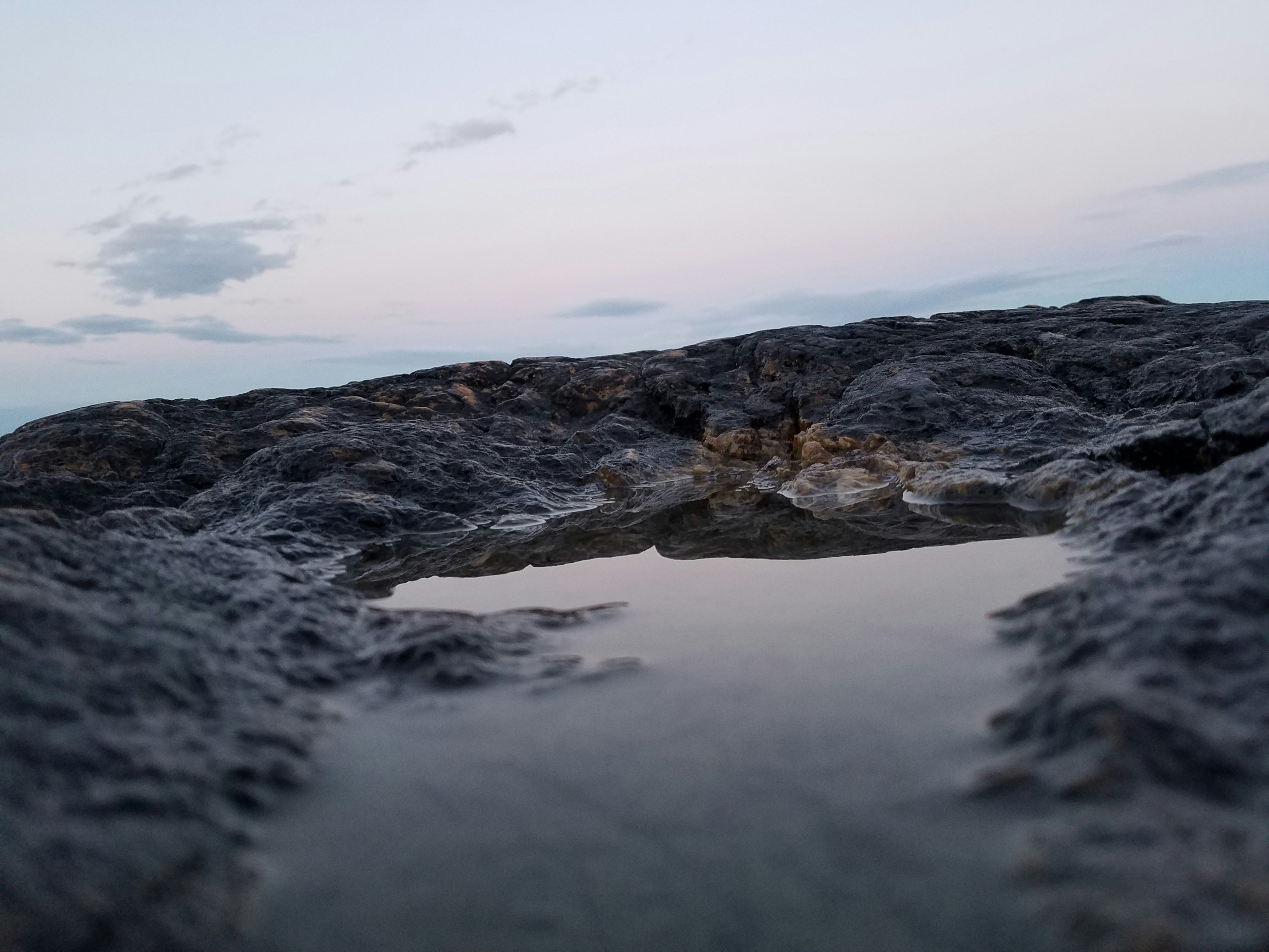 Twilight Reflections on Coastal Rocks