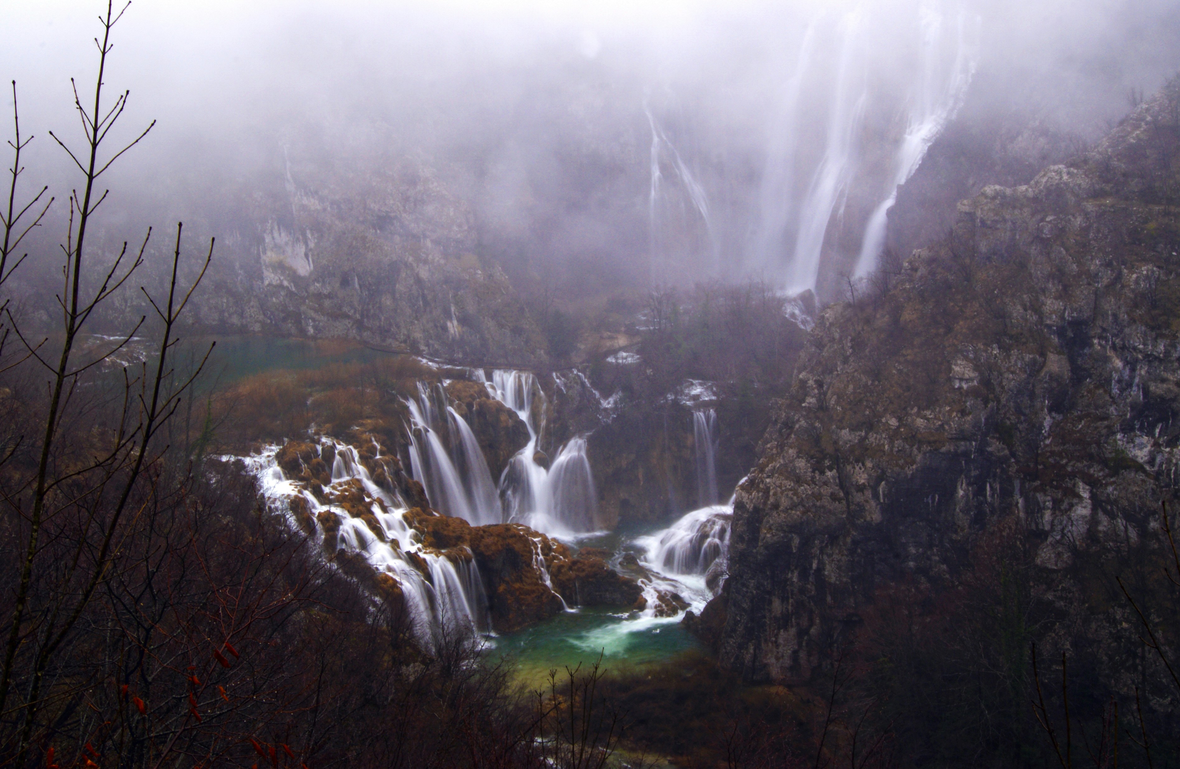 Life below the fog. | bird's eye view photography of waterfalls