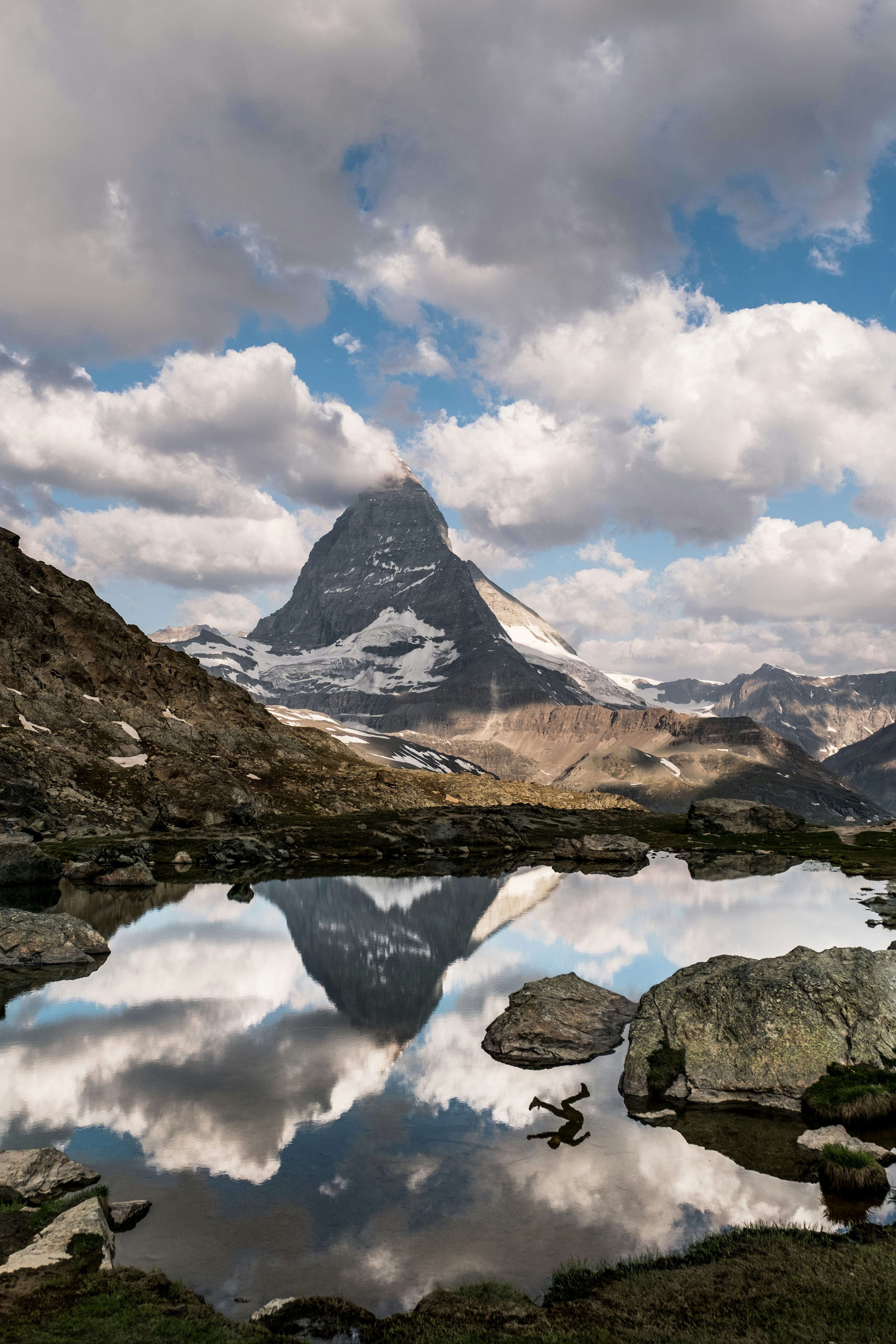 Calm body of water near mountain at daytime photo – Free Zermatt Image ...