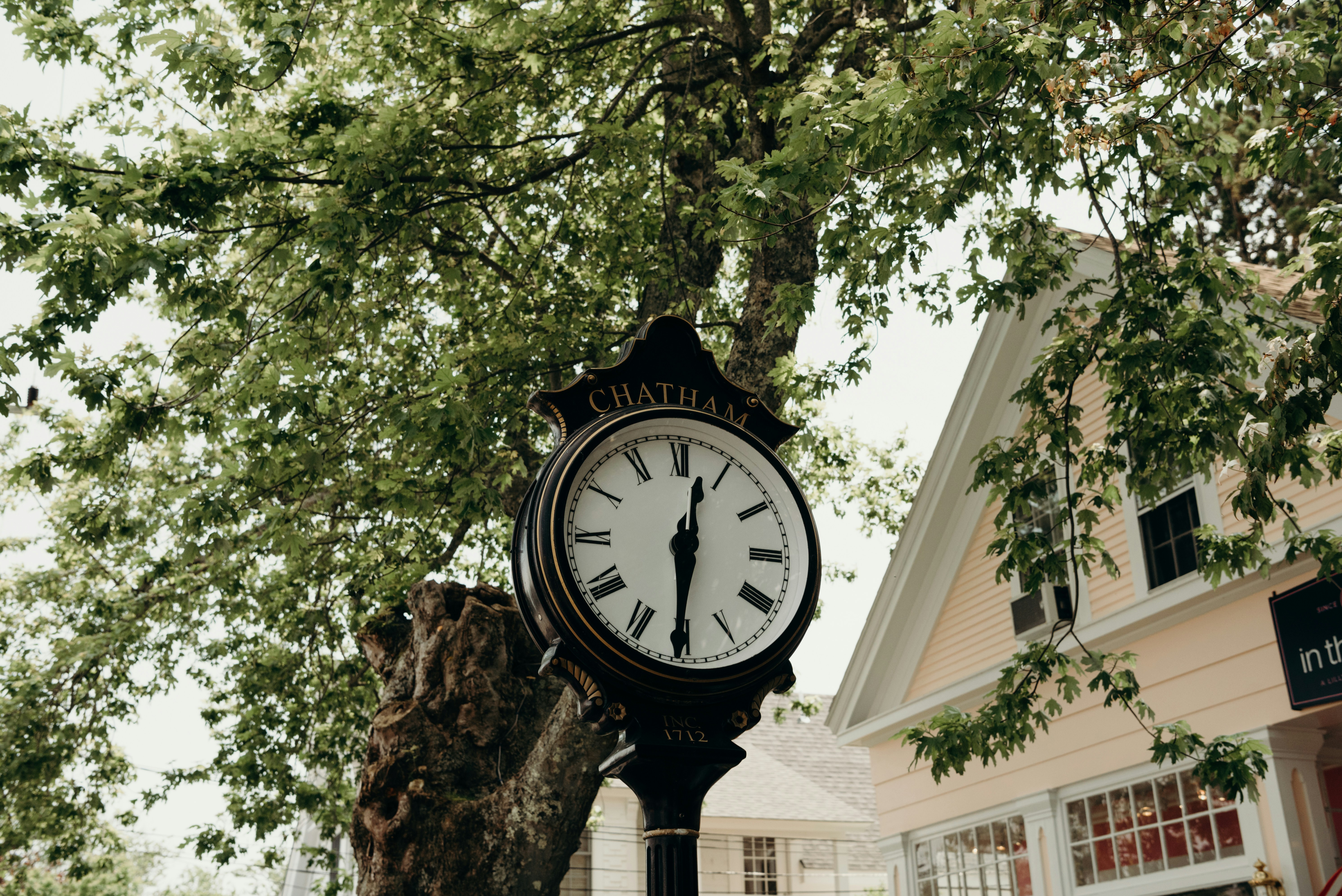 Dappled Daylight Frames The Chatham Clock in a Quiet Street Corner