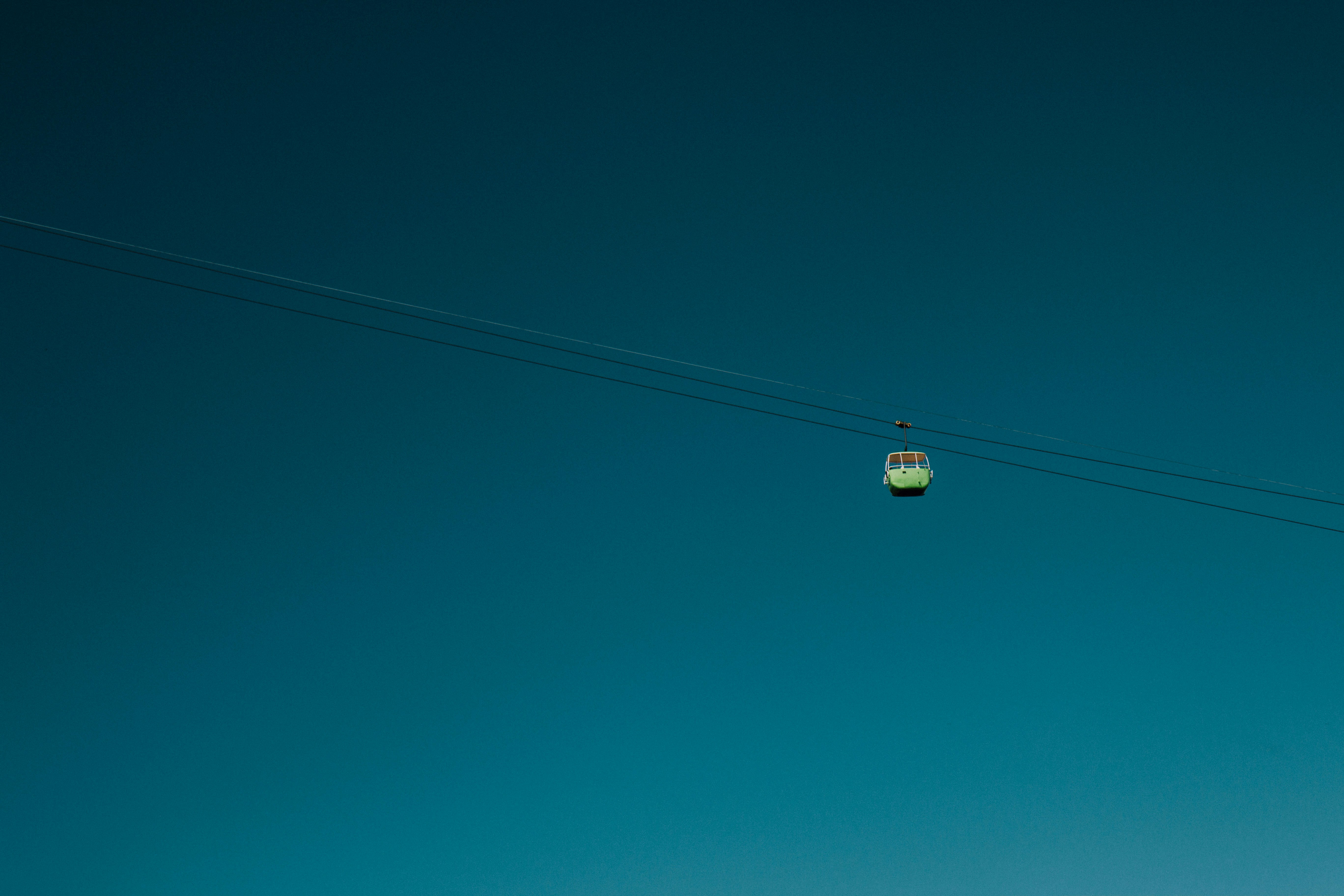 Green cable cart crossing wire photo – Free Blue Image on Unsplash