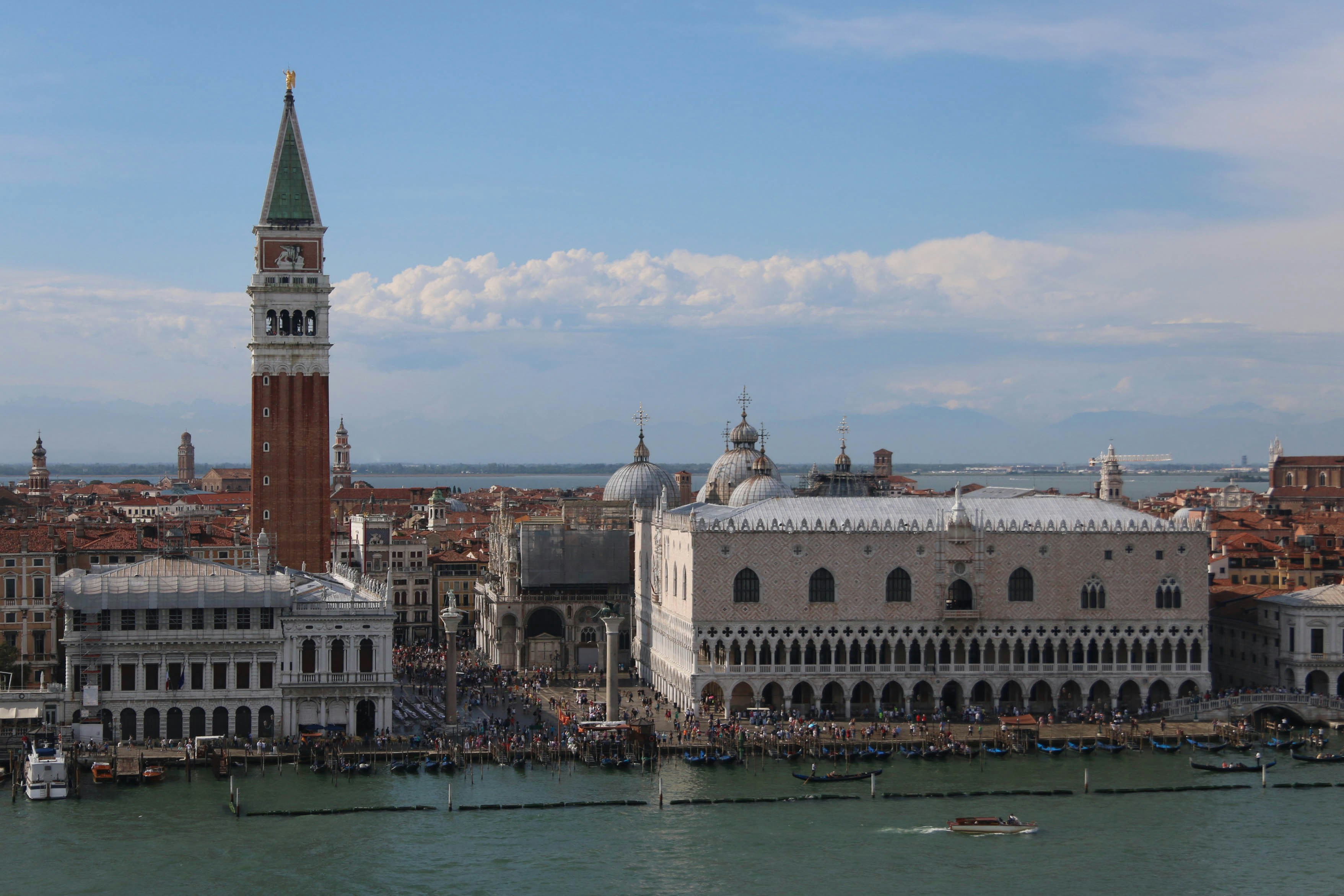 Venetian architecture with St. Mark's Campanile and Doge's Palace viewed from a cruise ship.