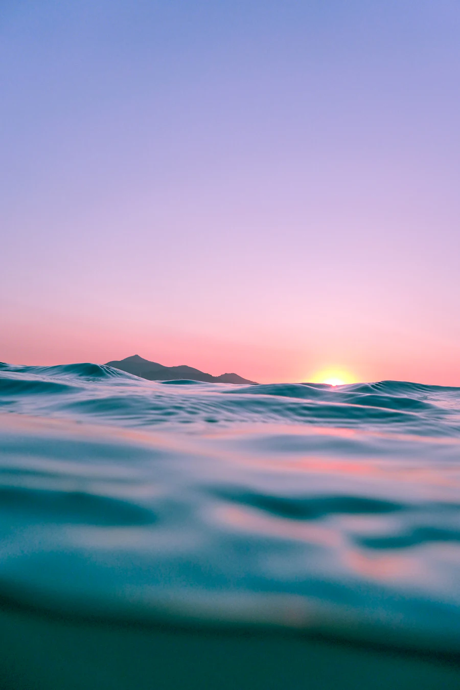 Waking up at 5.30 we entered the water just as the sun was rising. Even in a busy place there is always a time when most people are sleeping and you can find a tranquil moment for yourself. | calm body of water during golden hour