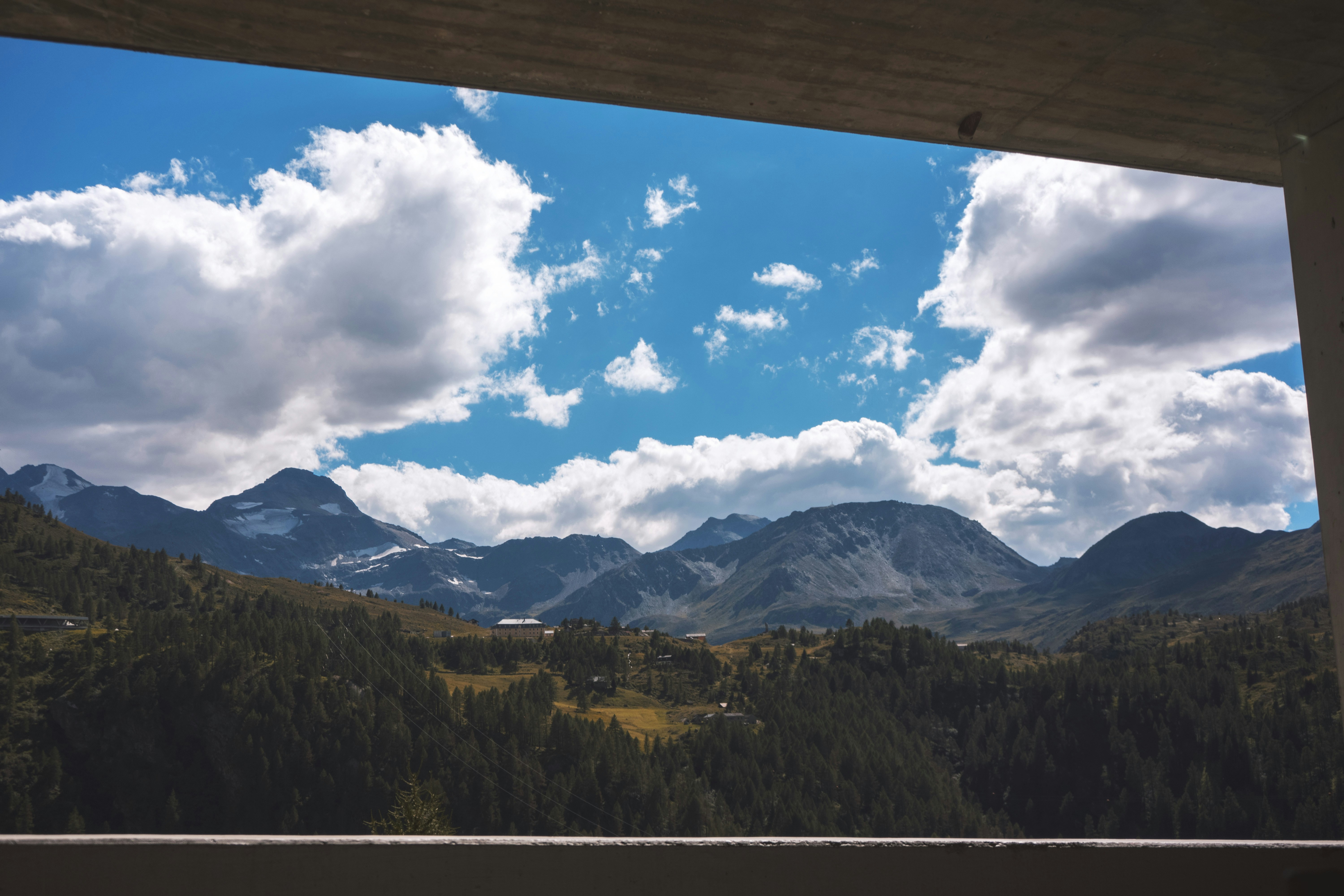 Balcony Vista: Alpine Crest Framed by Shadow and Rail