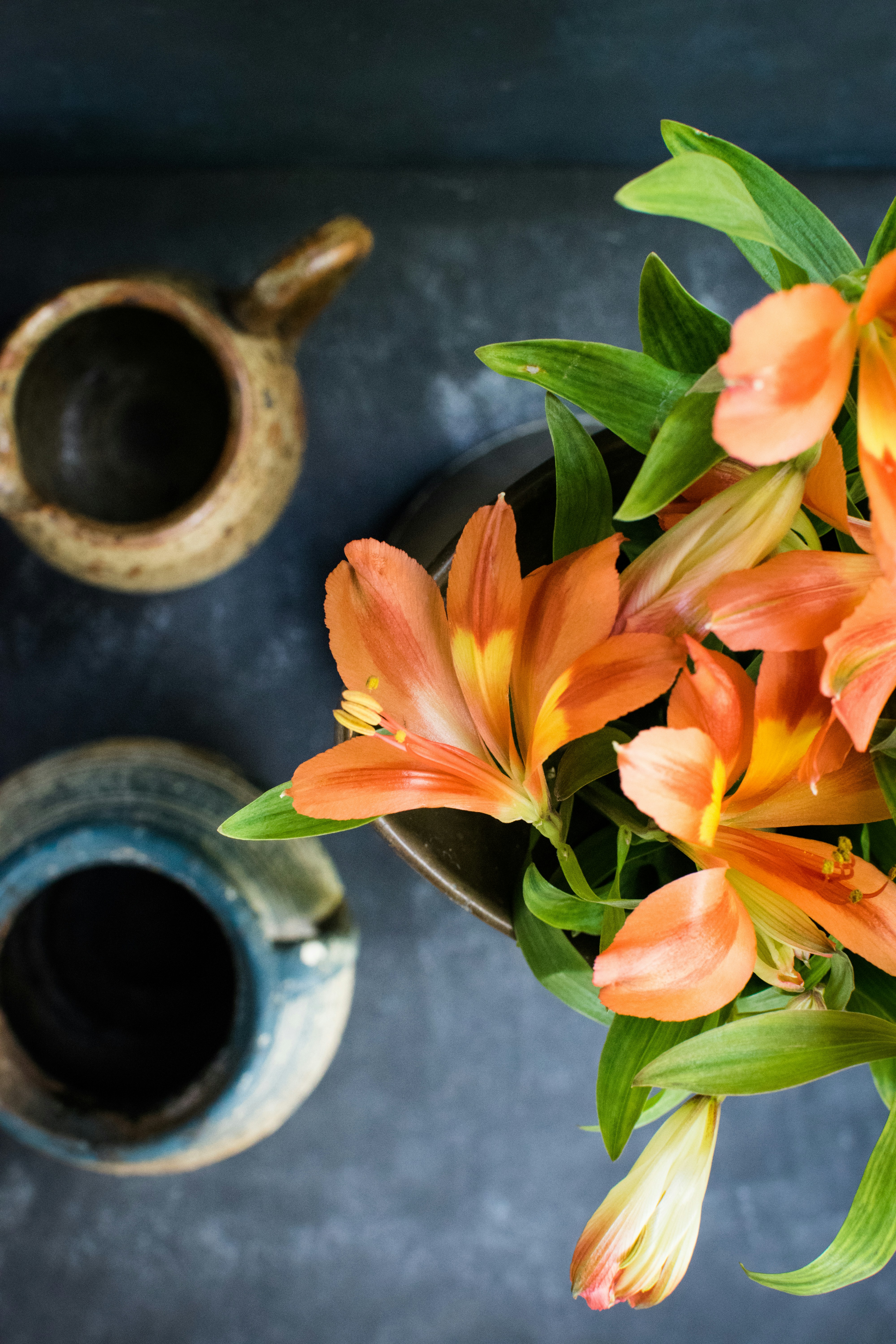 Orange Lilies in a Quiet Studio Still Life with Ceramics