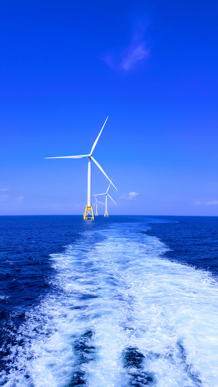 The first off shore wind farm in the USA went online May 1st 2017 in block Island RI. | three white wind turbine on sea
