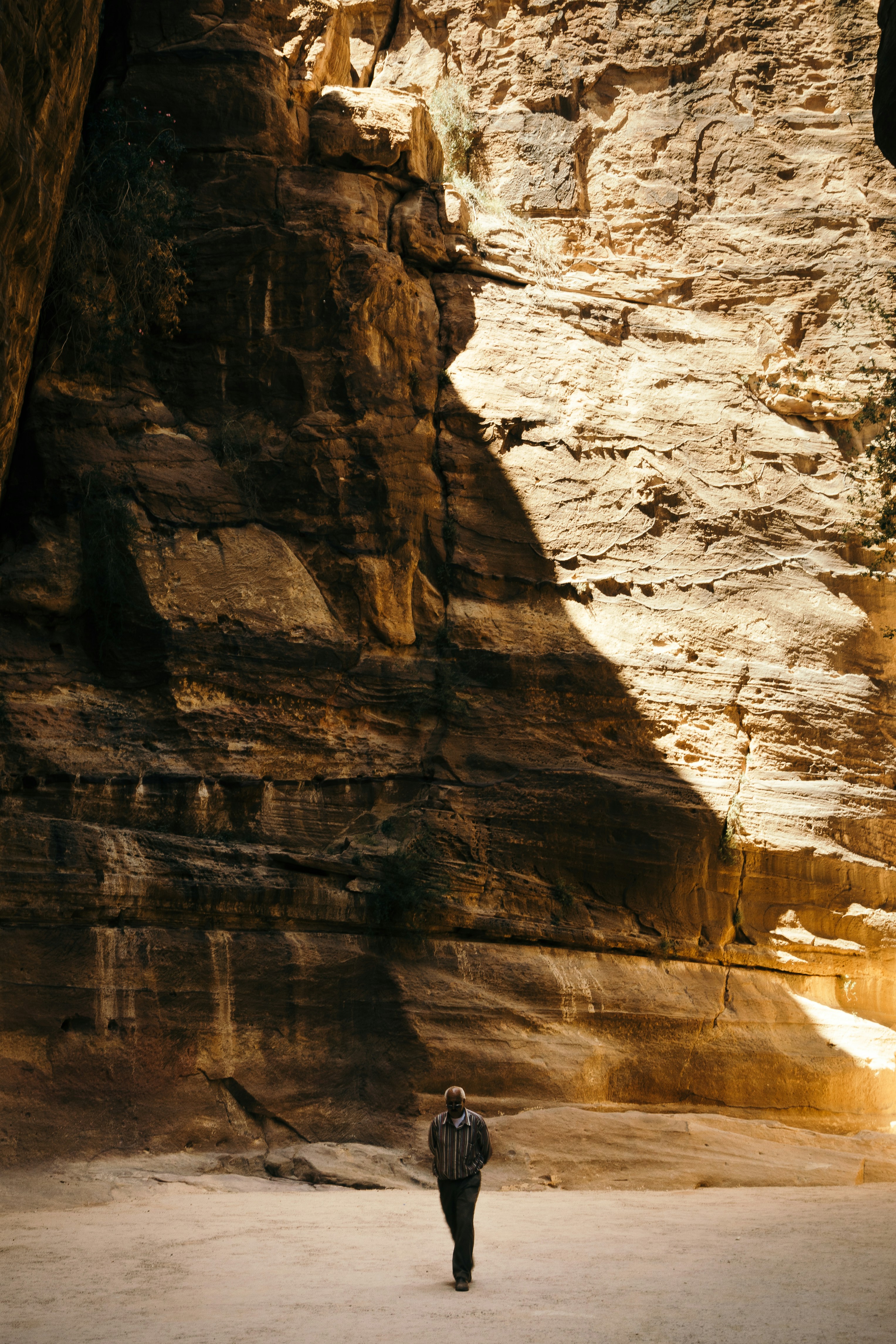 a person standing in front of a mountain sideAdam Jang
