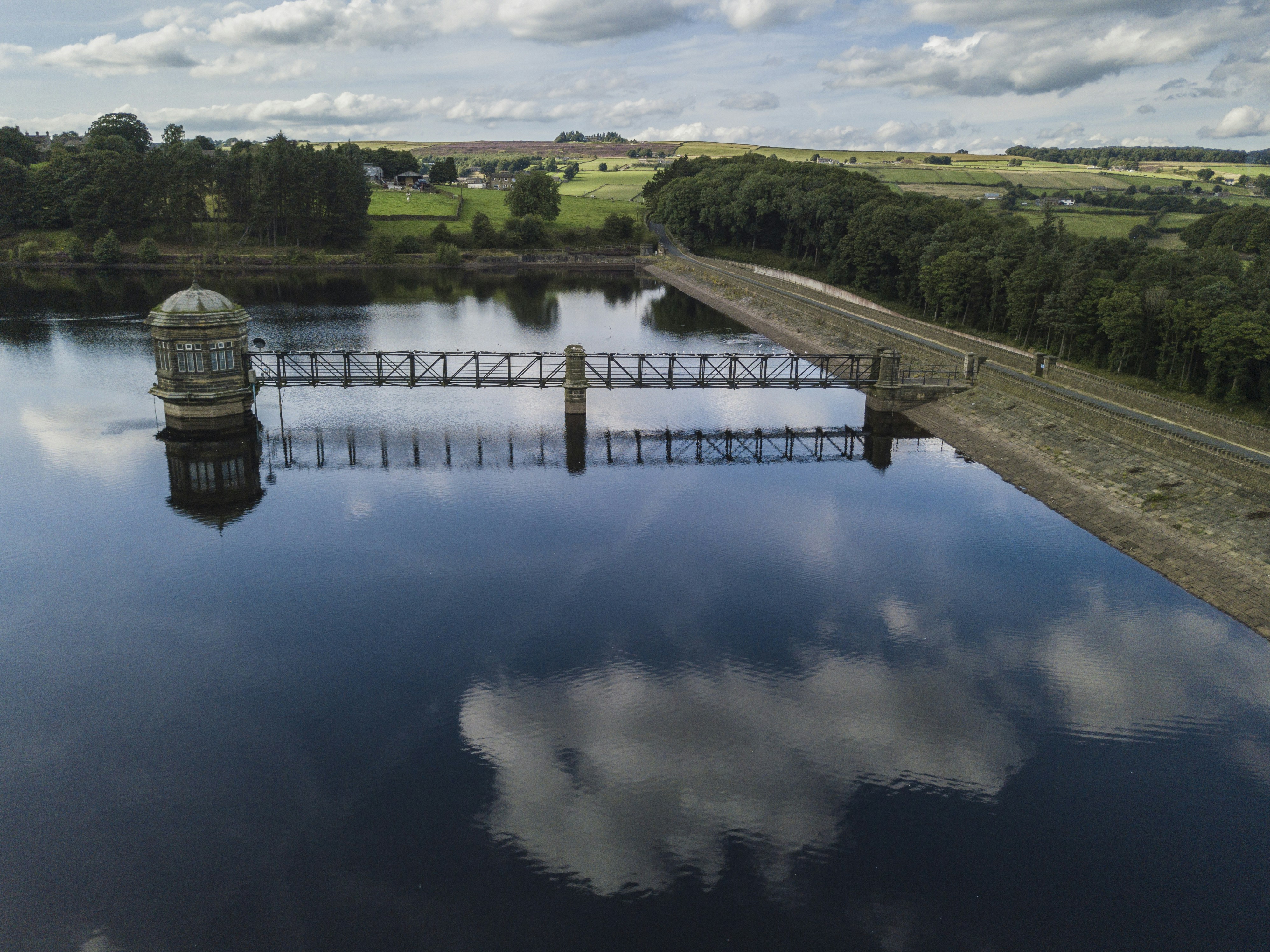 Bridgekeeper on the Still Mirror: Aerial View of a Waterway Lock and Distant Fields