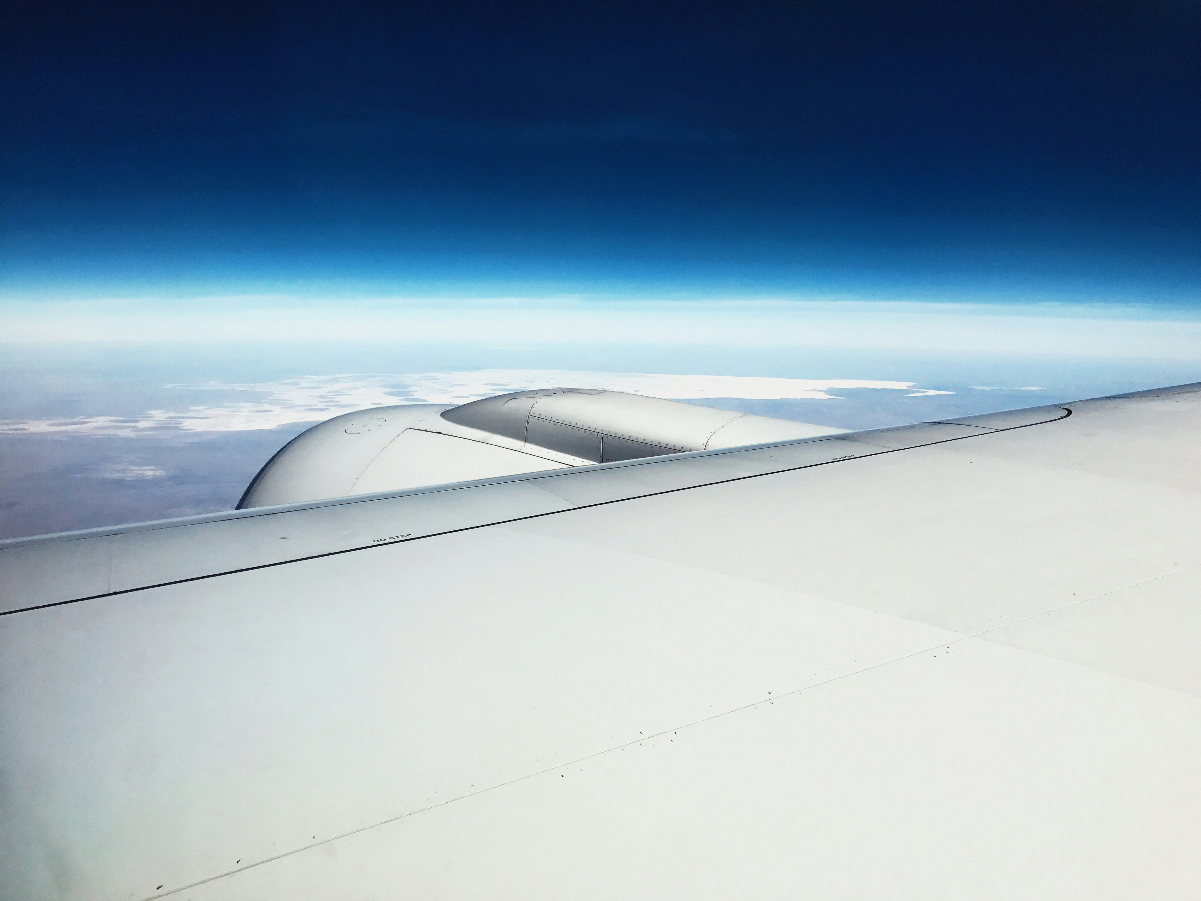 Airplane wing under blue sky photo – Free Blue Image on Unsplash