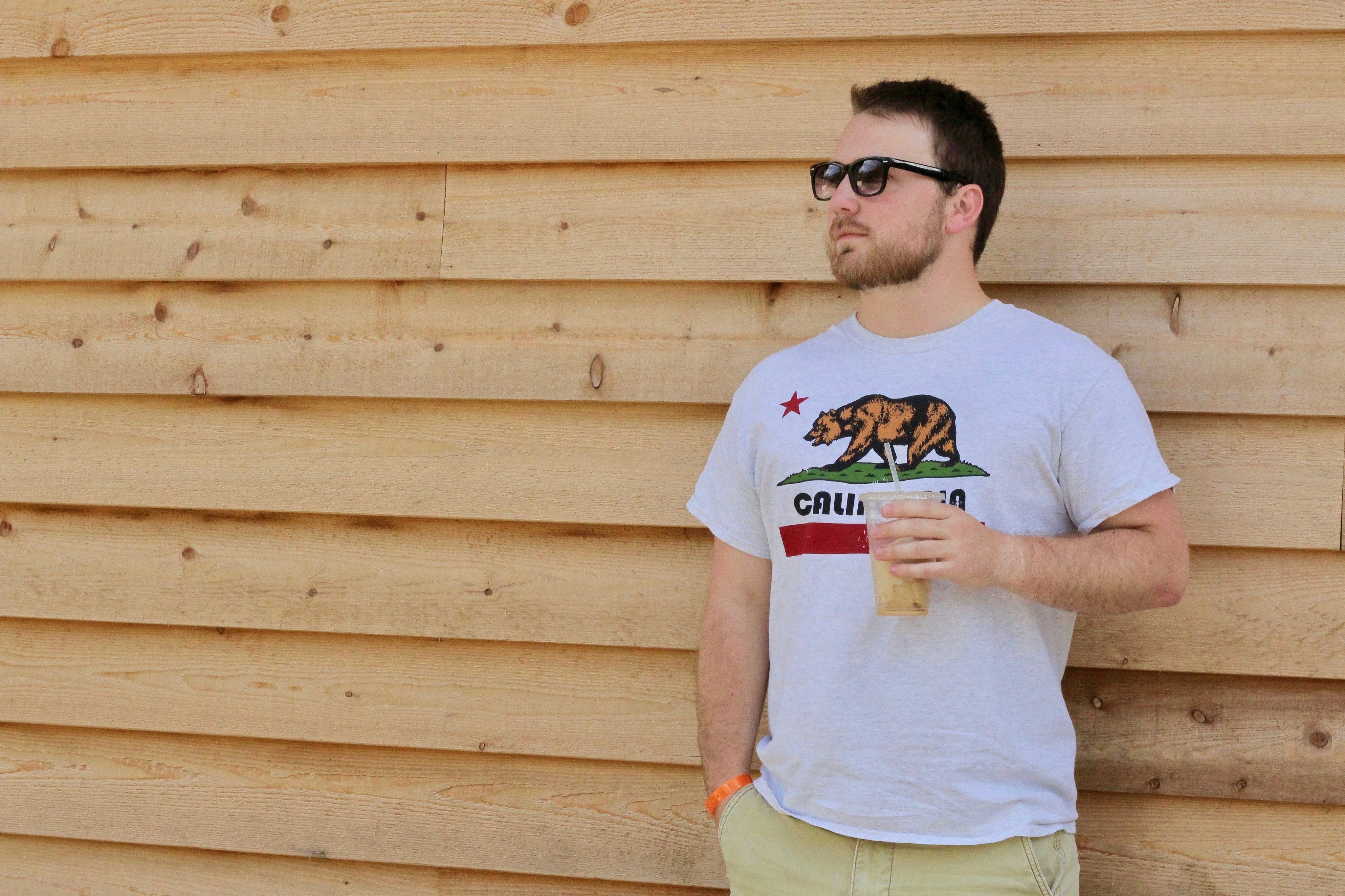 Sun-Washed Cedar Portrait: A Relaxed Moment with Beer