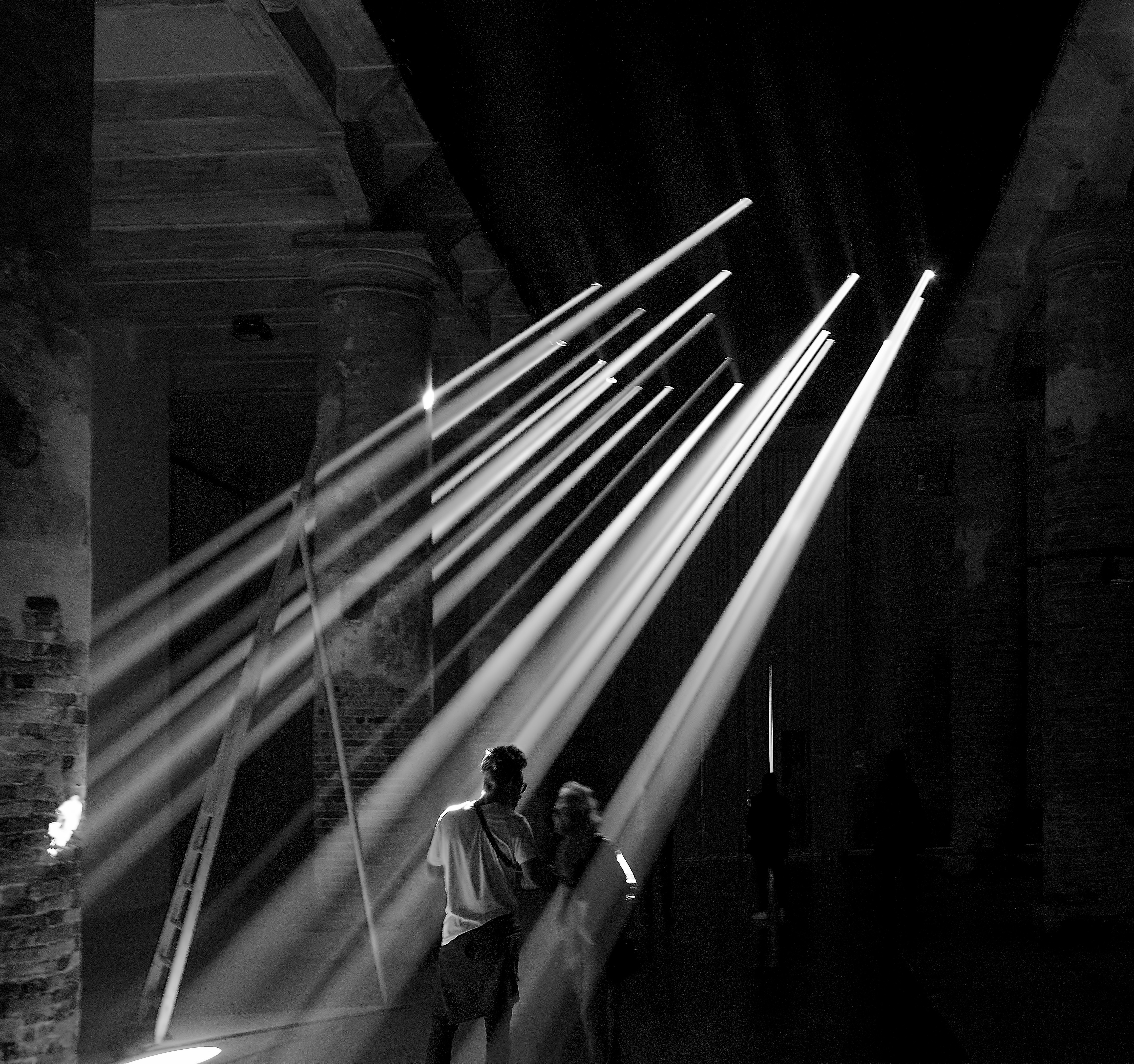 Man standing near post photo – Free Building Image on Unsplash