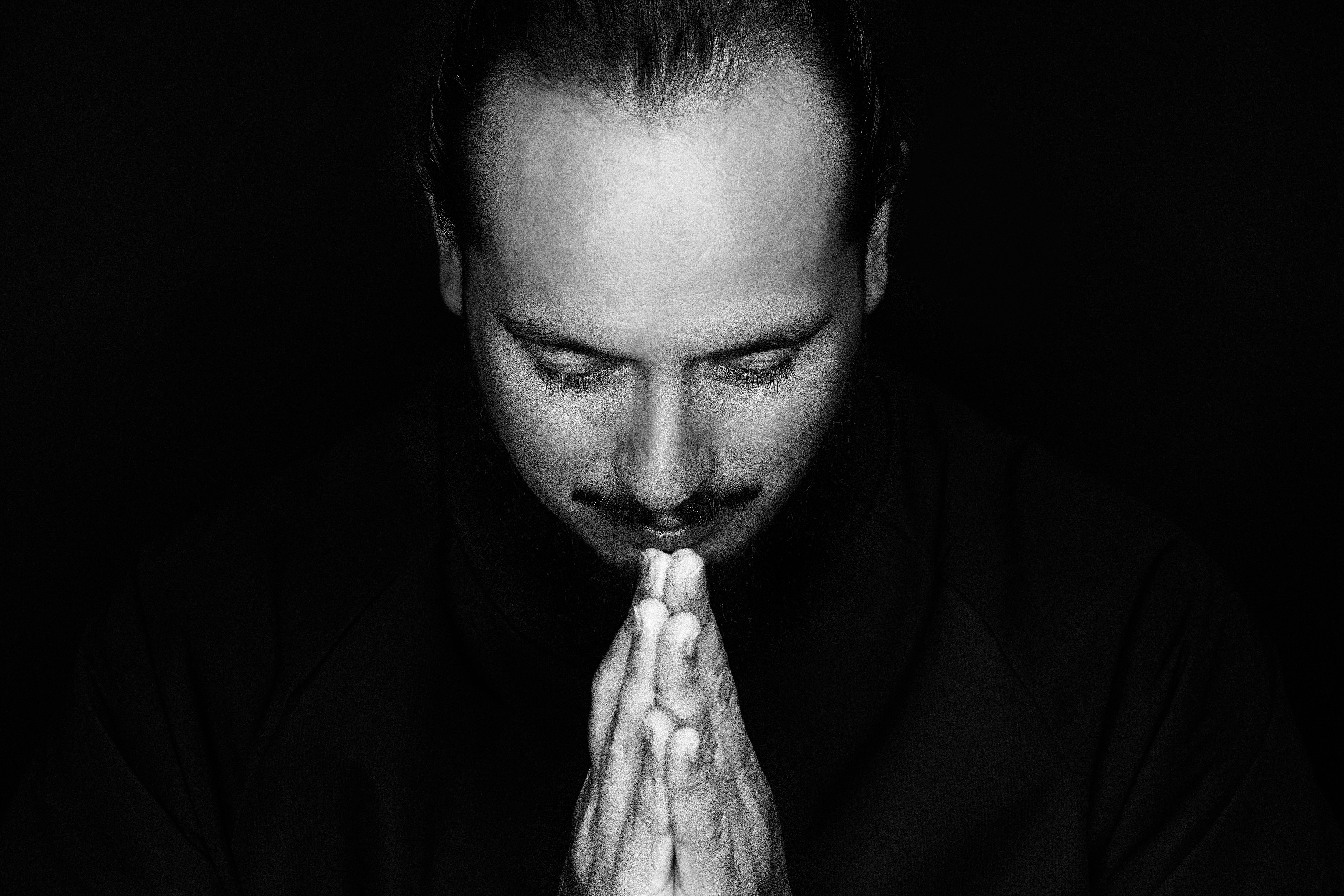 Grayscale photo of man praying photo – Free Portrait Image on Unsplash