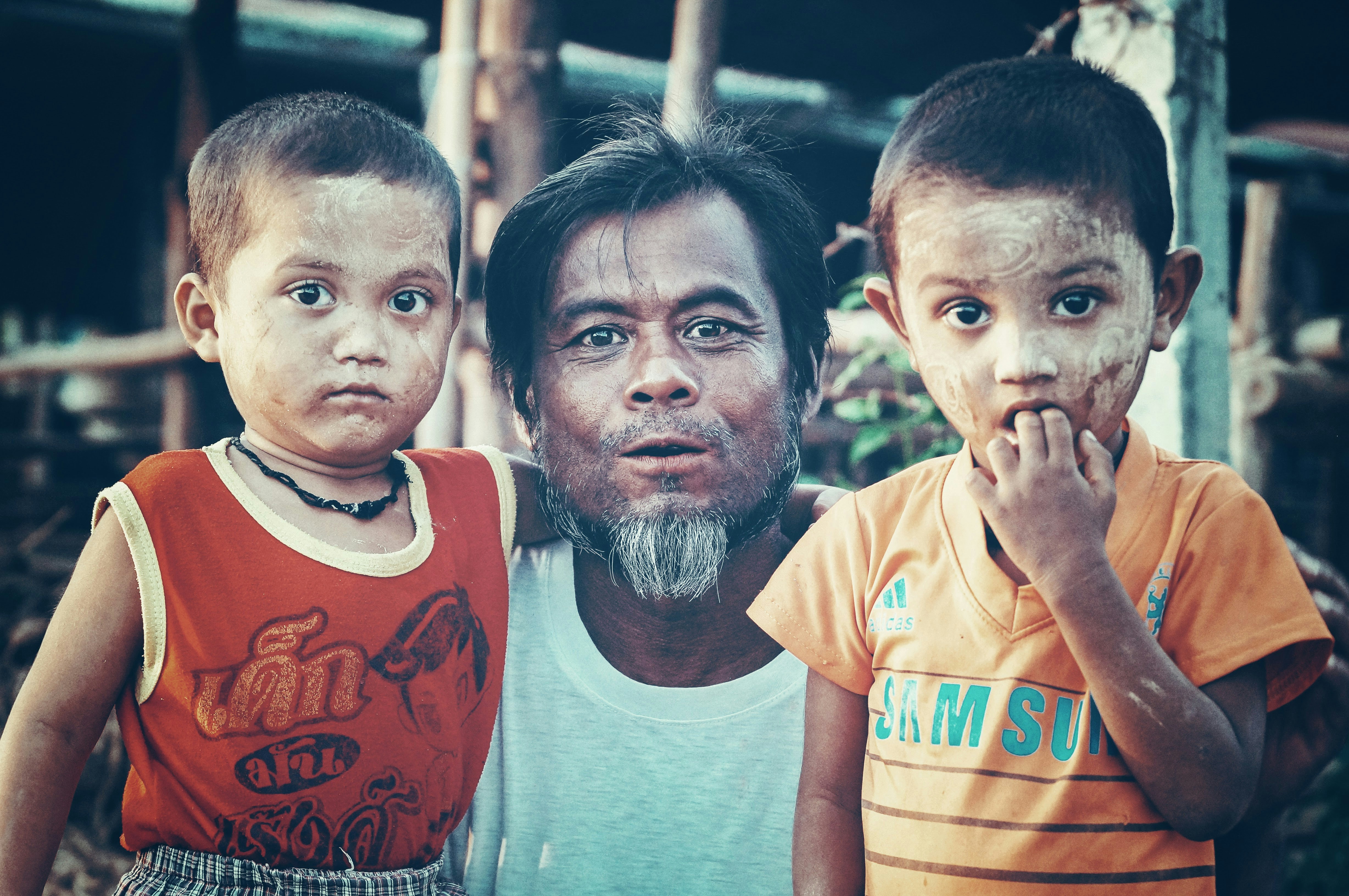 Man standing between two boys photo – Free Thailand Image on Unsplash
