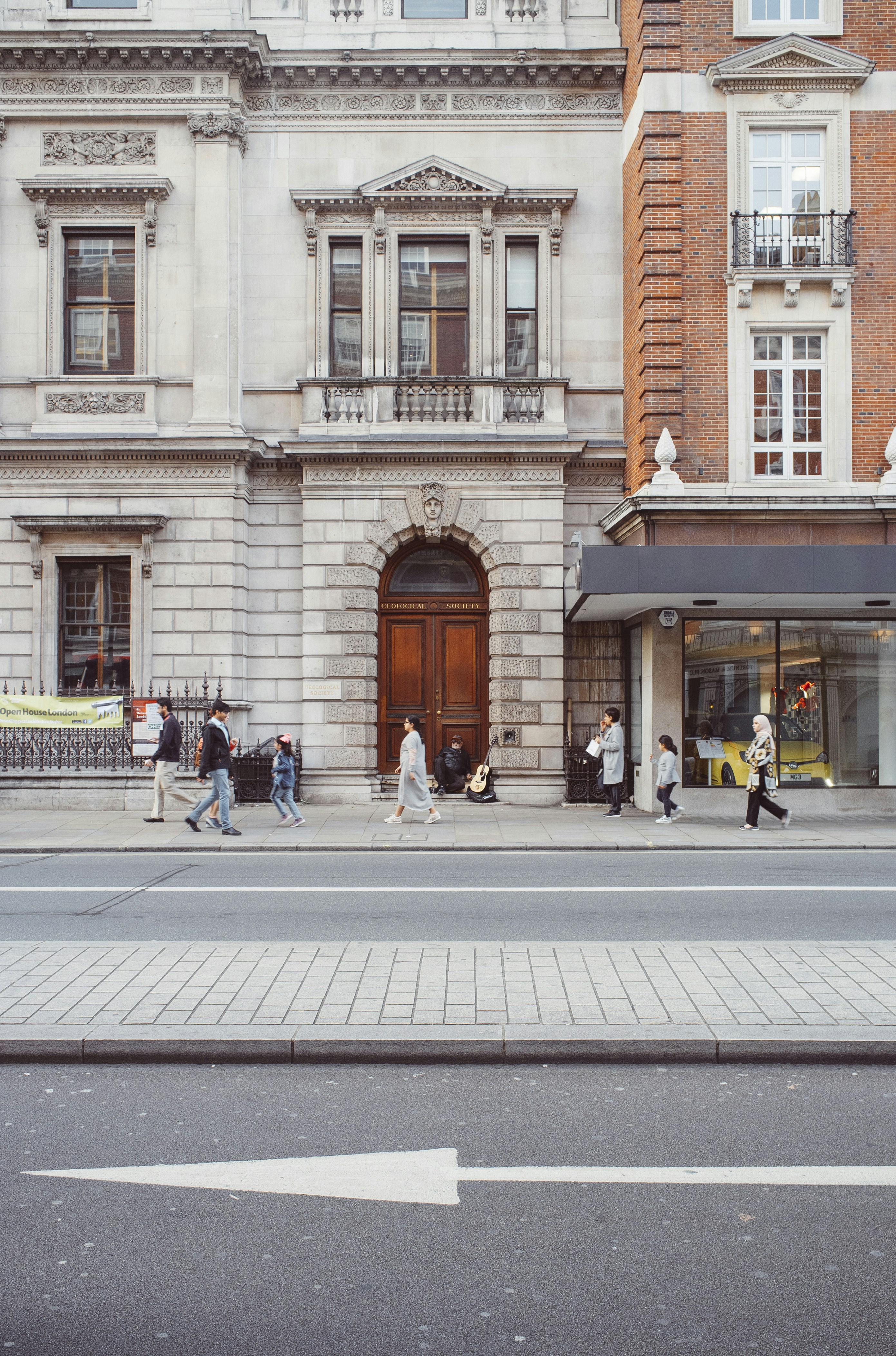 People sitting on bench near building during daytime photo – Free ...