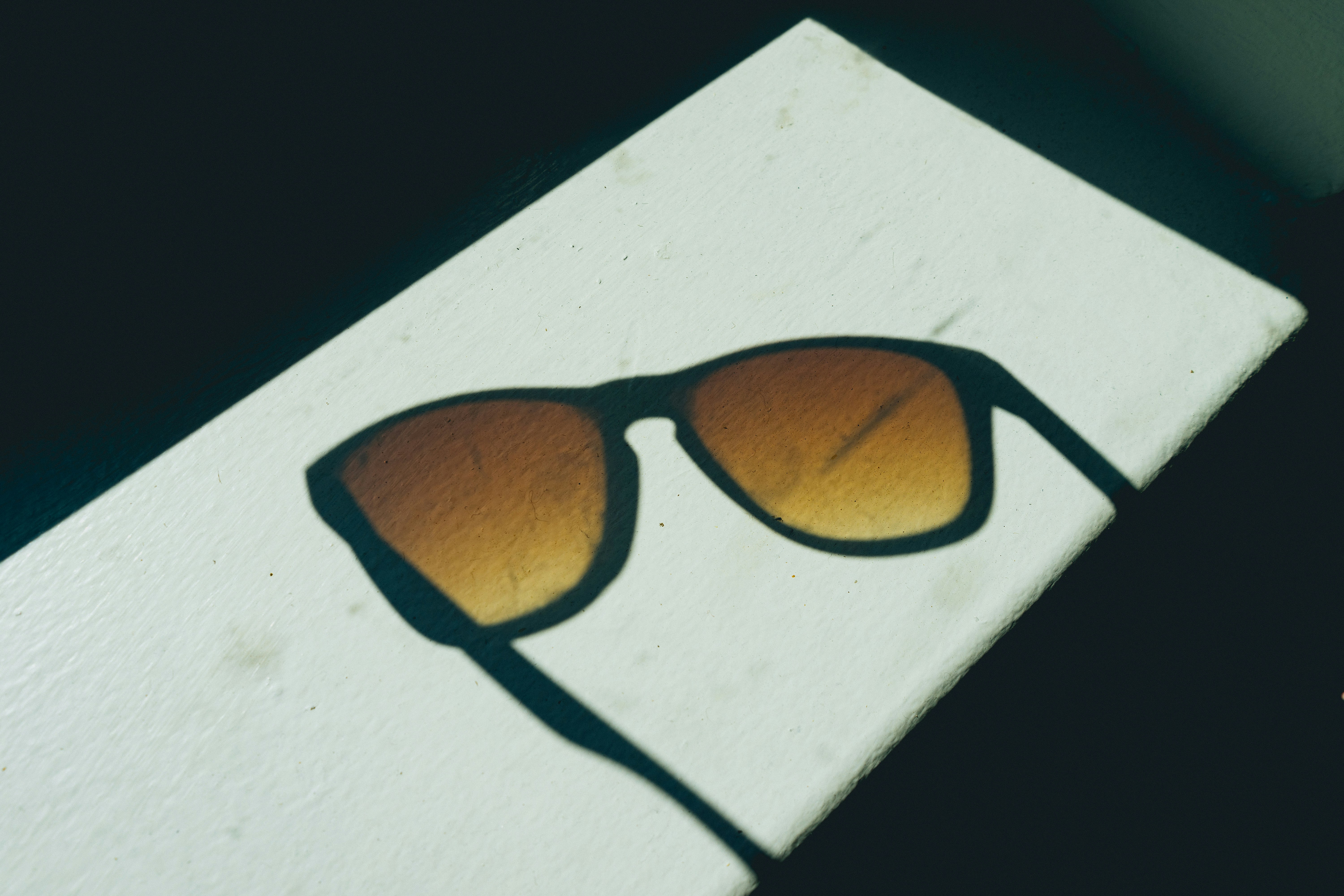 sunglasses on white surfaceDan Gold