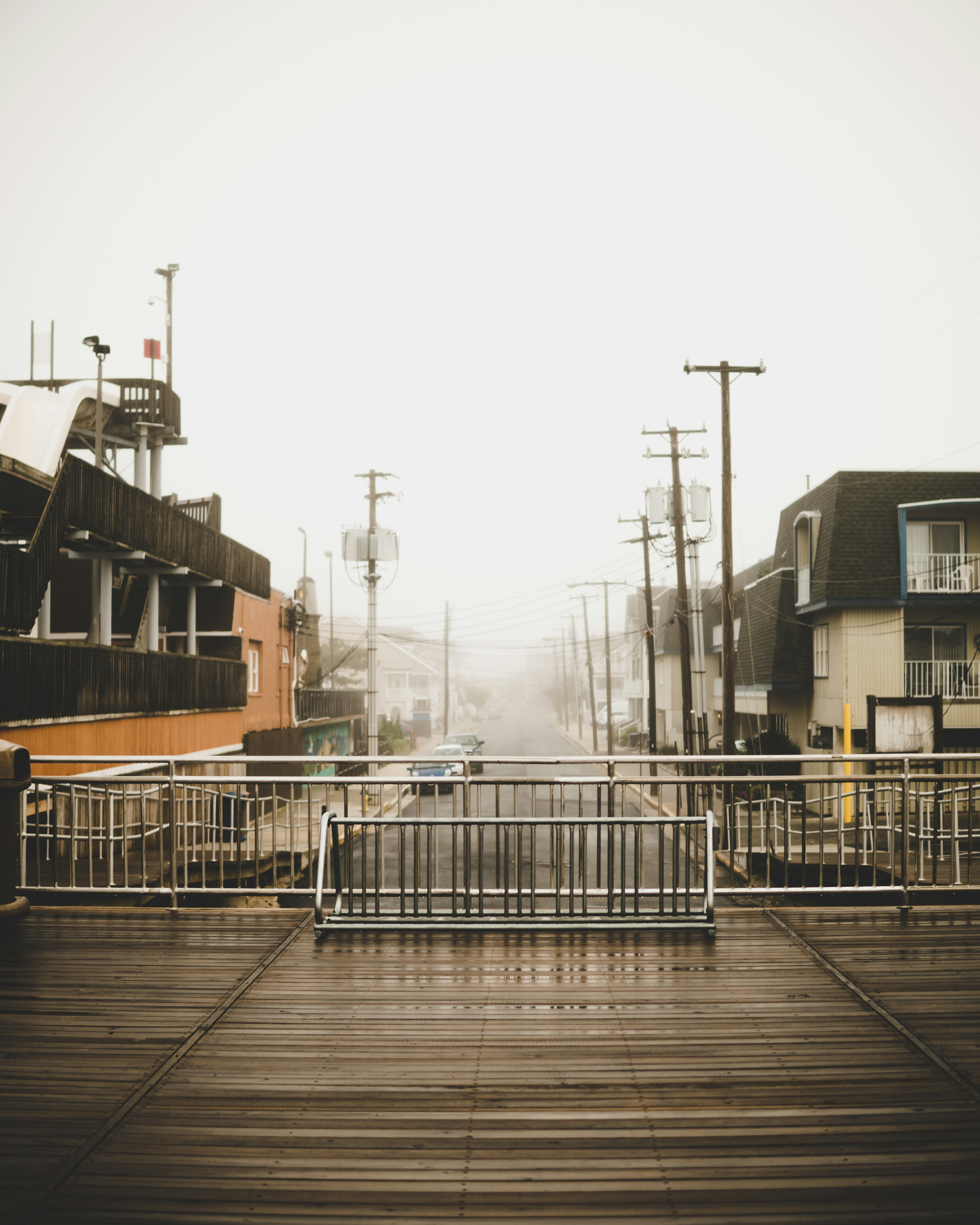 Fogbound Avenue: Rails framing a distant vanishing point