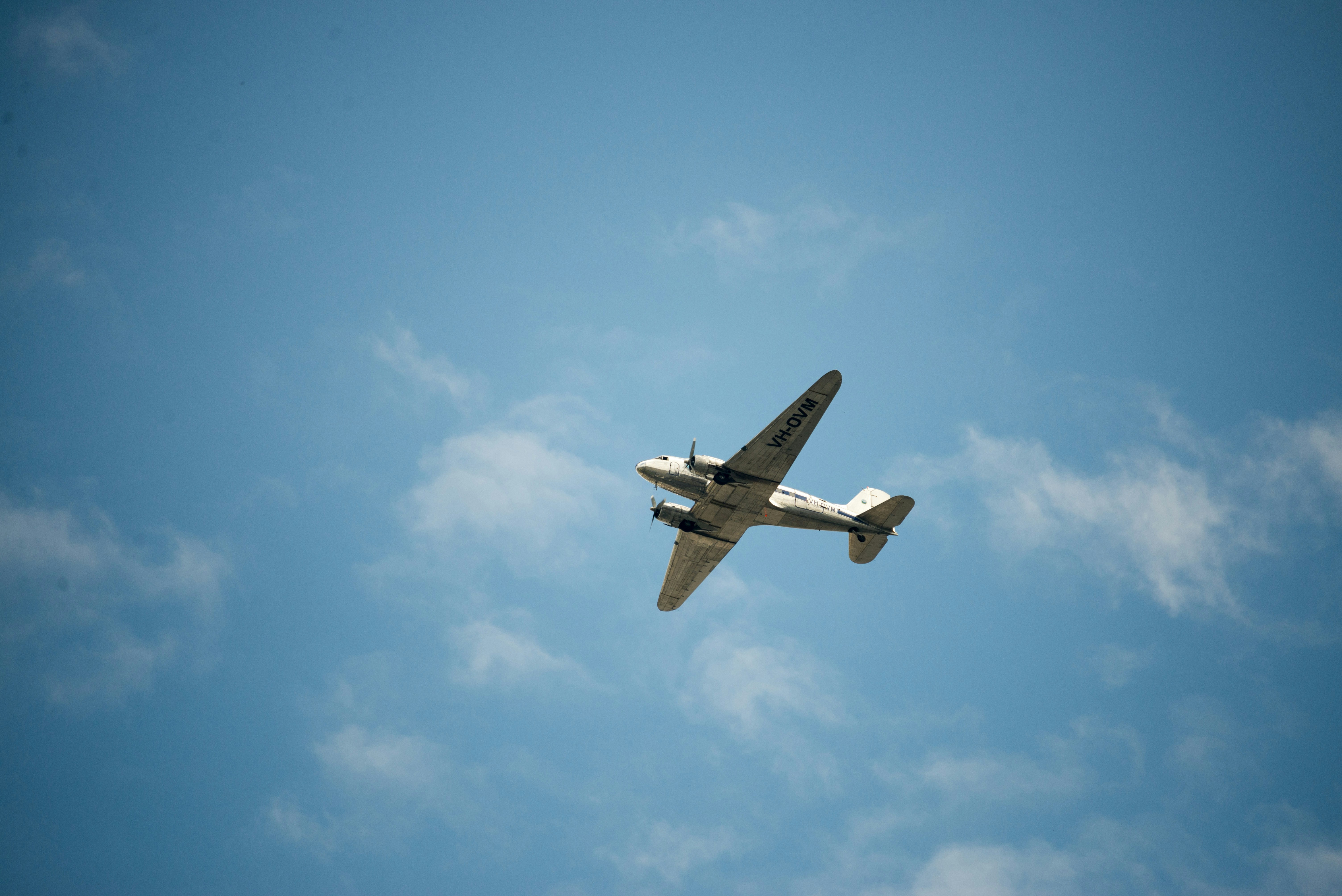 Low angle of white monoplane photo – Free Blue Image on Unsplash