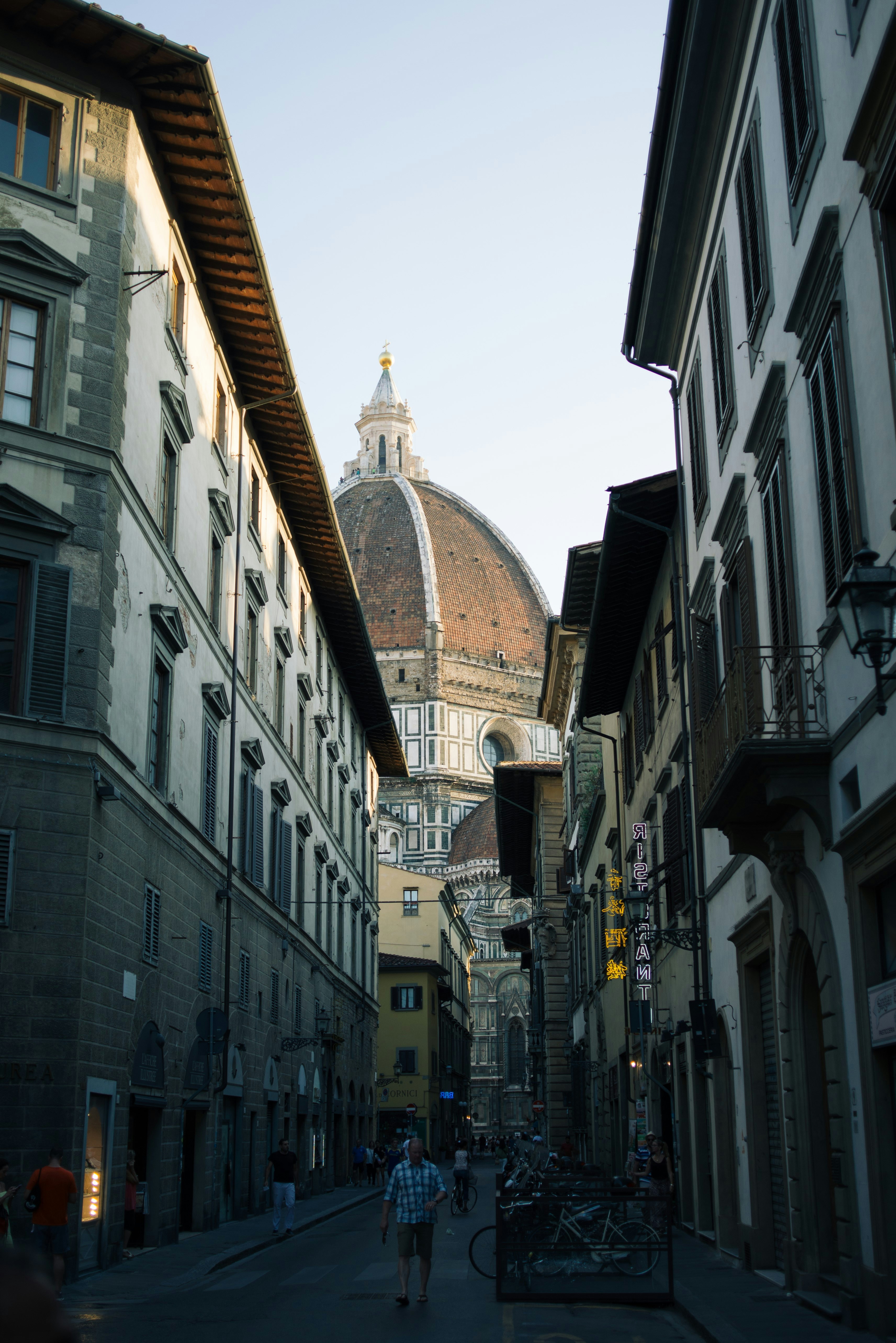 View of dome structure from street with houses photo – Free Italy Image ...