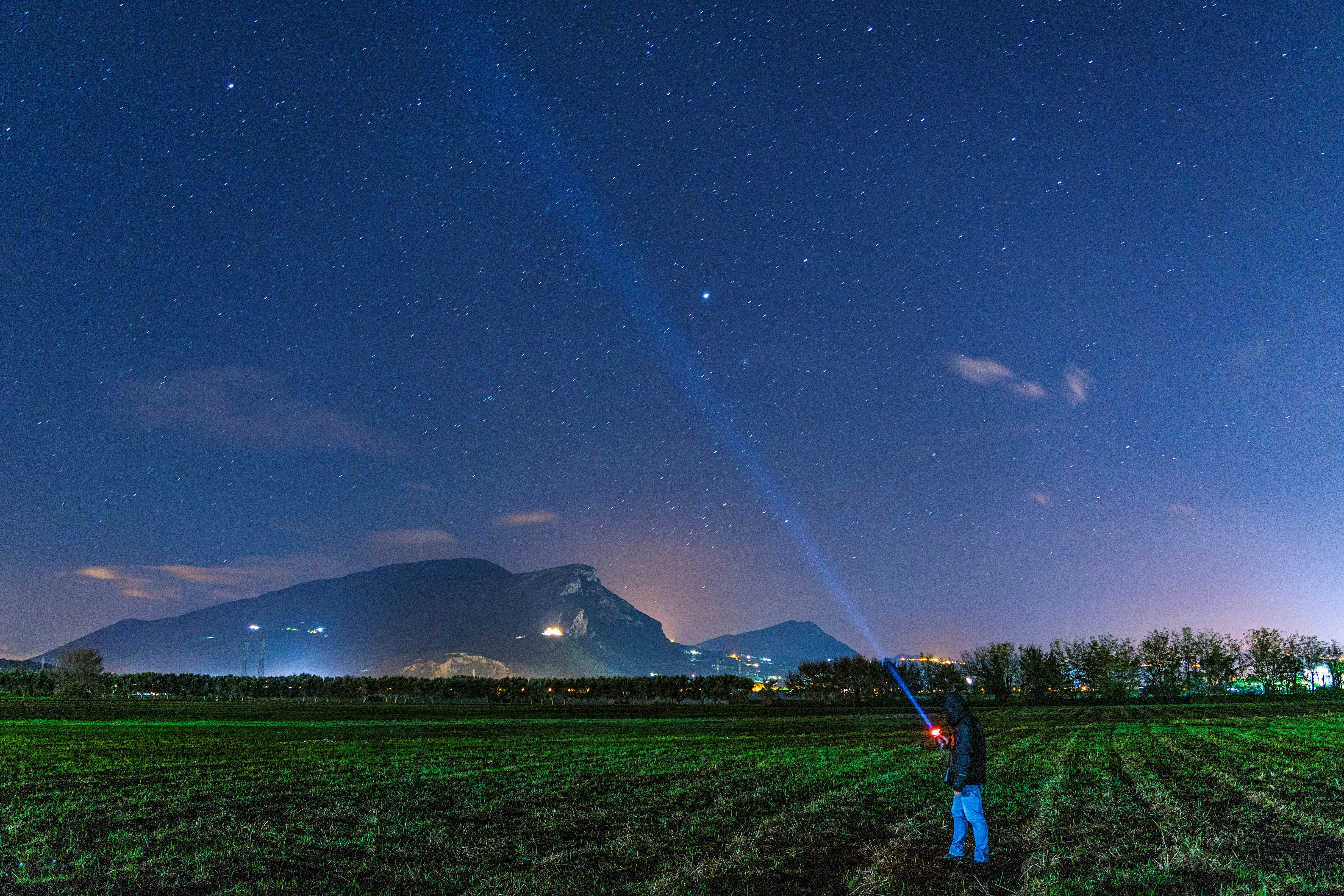 Lone Beacon Under a Cathedral of Stars