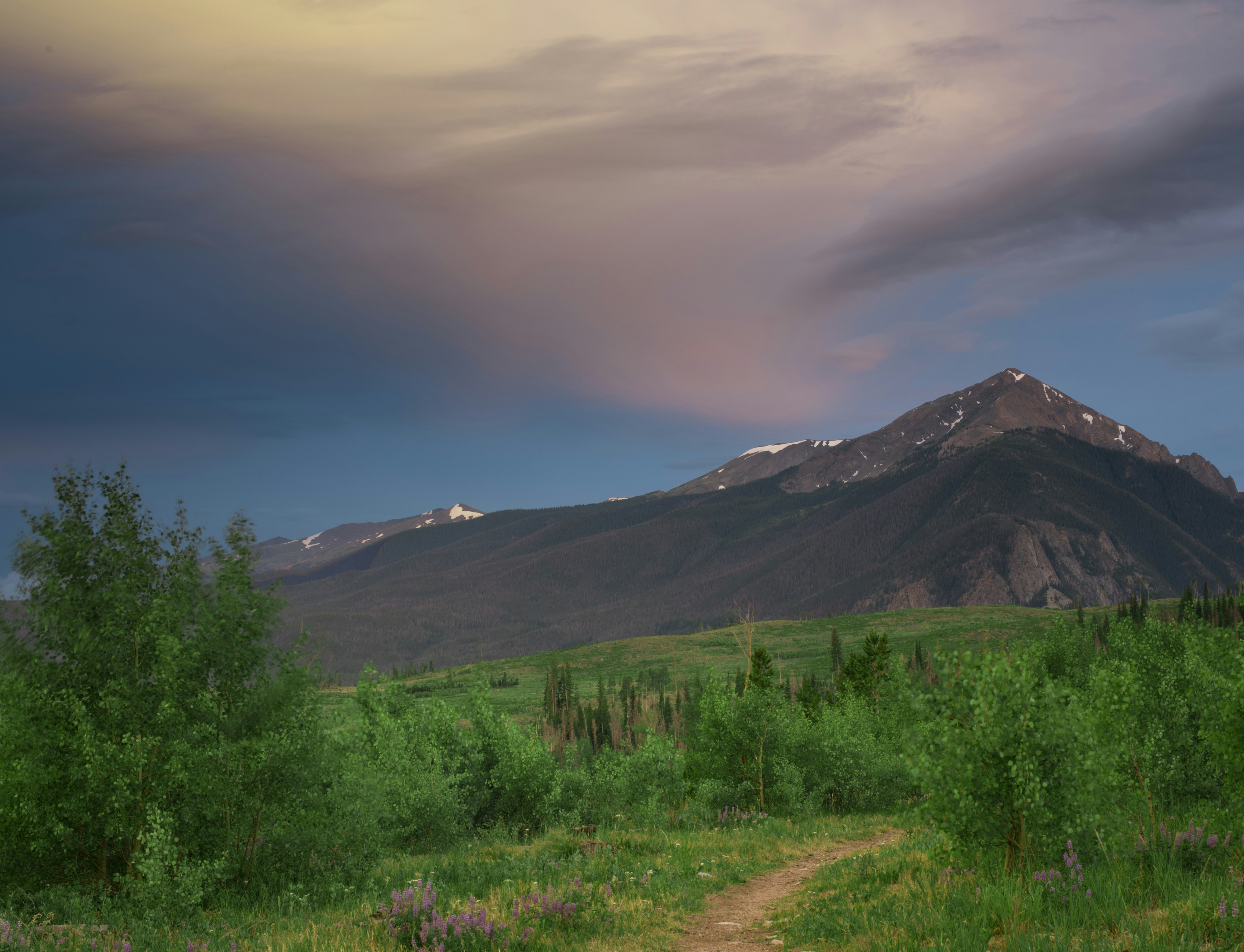 Emerald Valleys Under a Colossal Peak