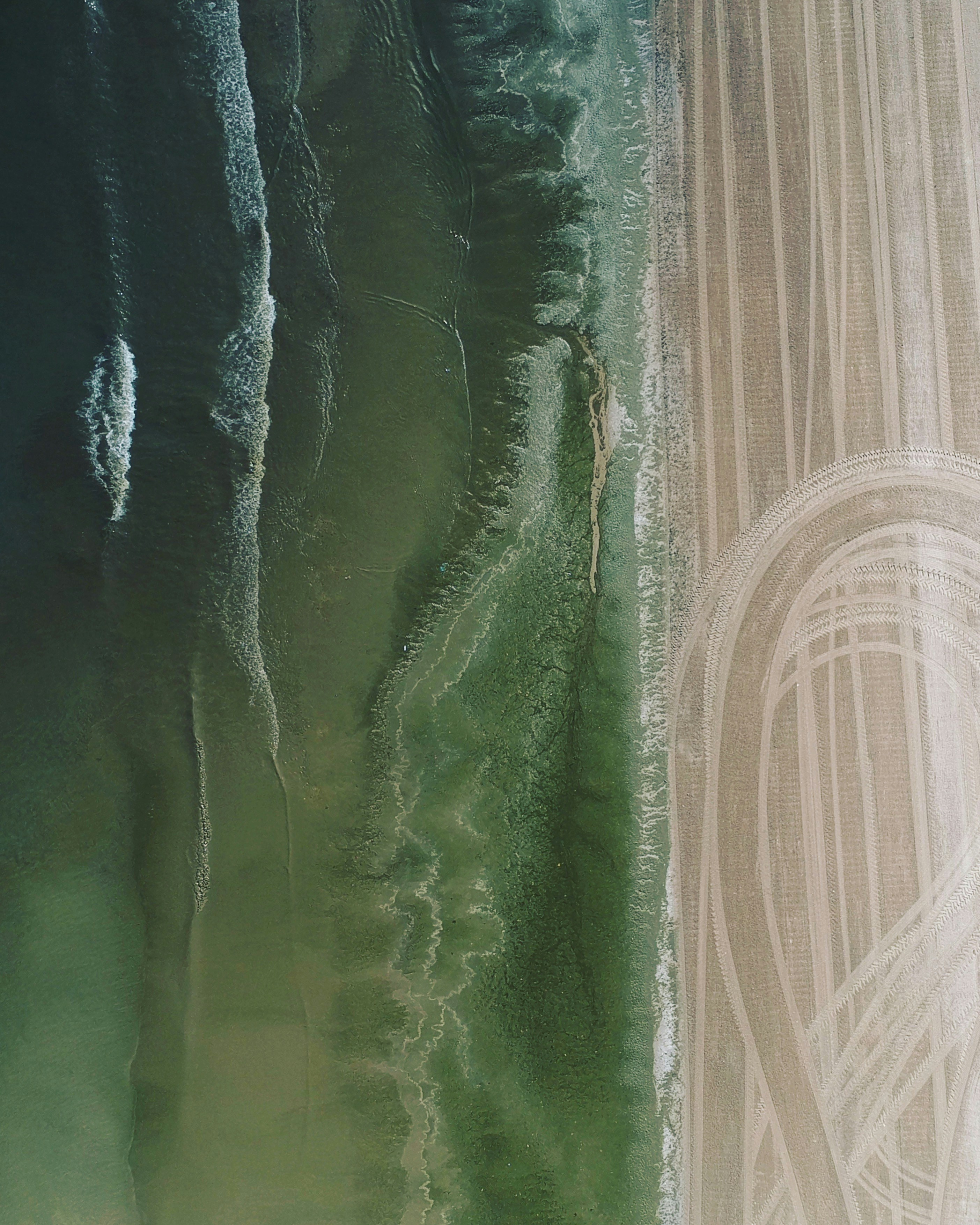 Aerial photo of soil and body of water photo – Free Beach Image on Unsplash