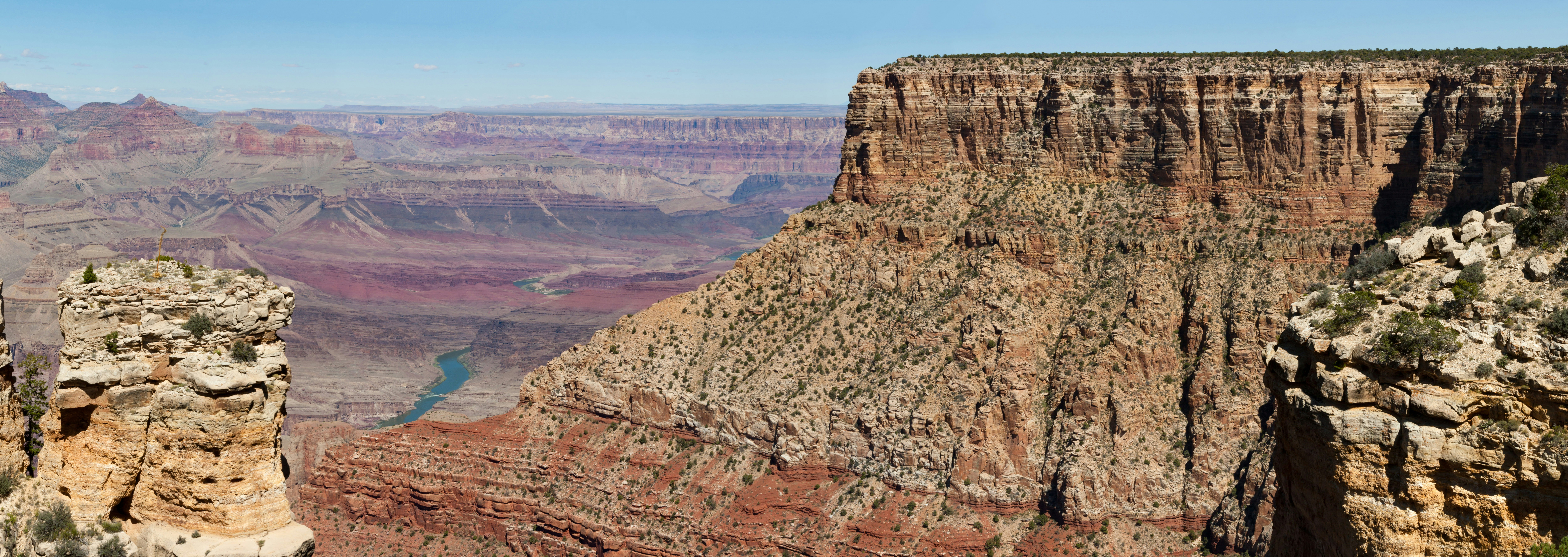 Ribbon of Blue Across Layered Canyon Walls