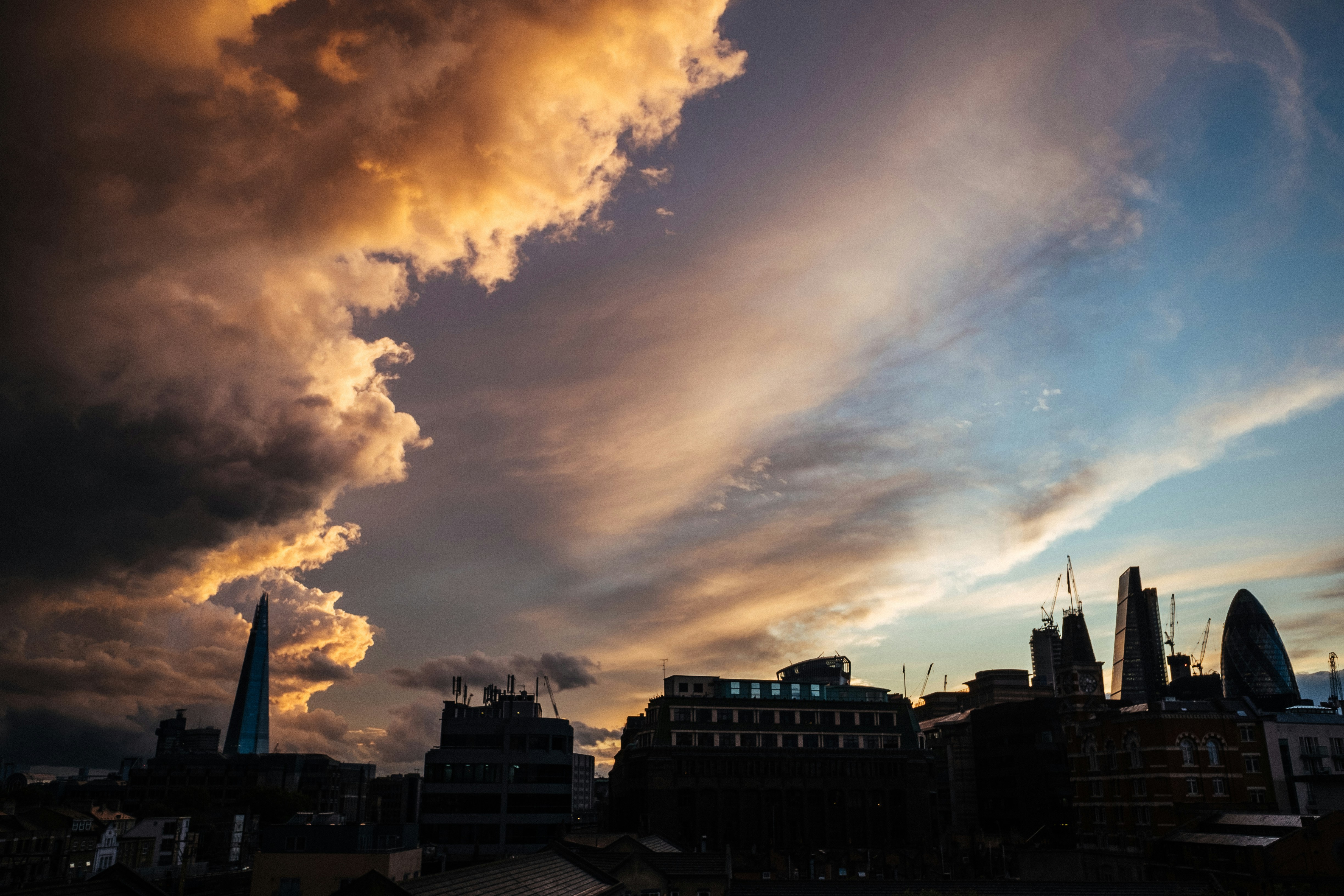 City Horizon at Dusk: Silhouettes Against a Fiery Sky