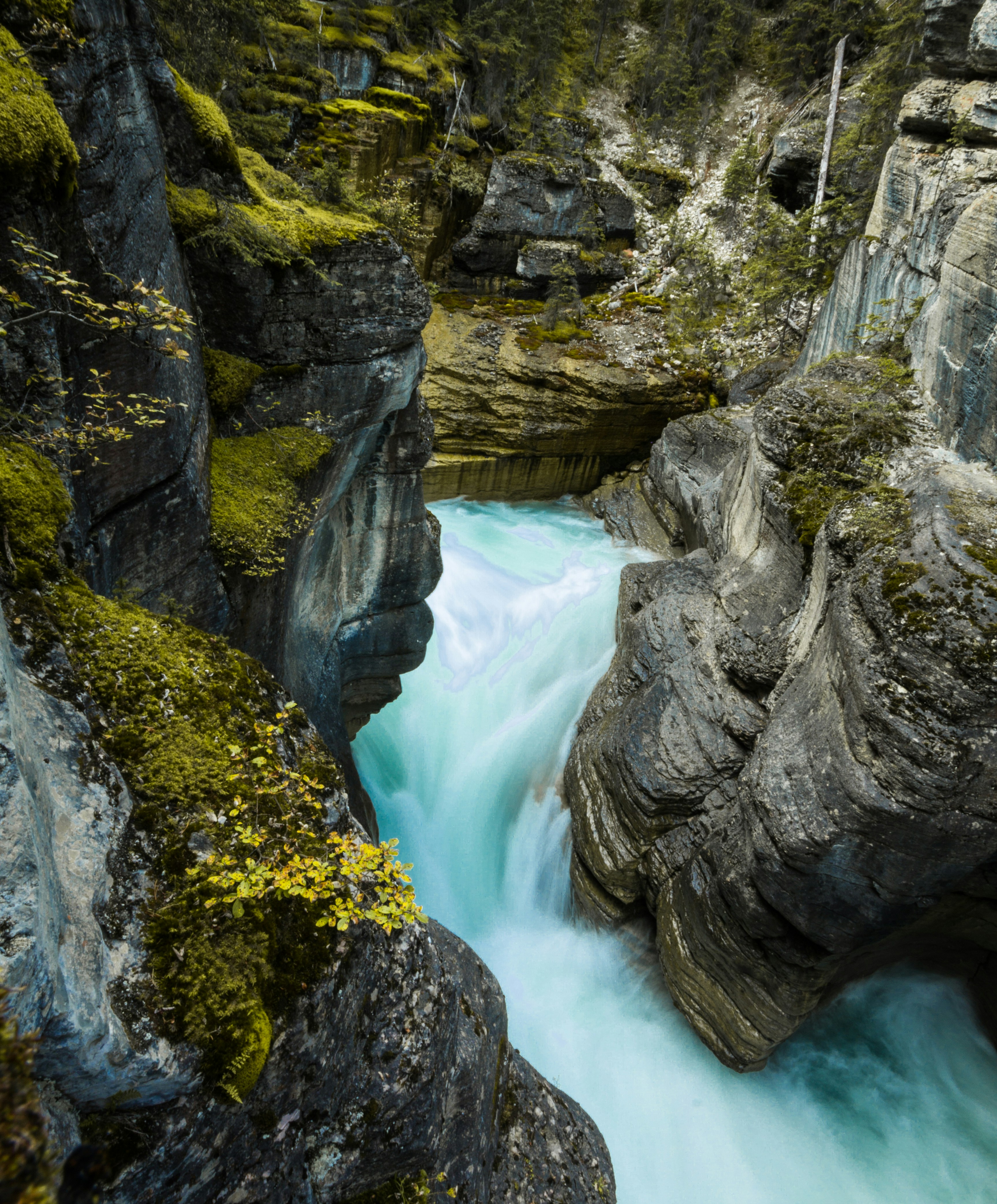 Water falls between gray rock formation during daytime photo – Free ...